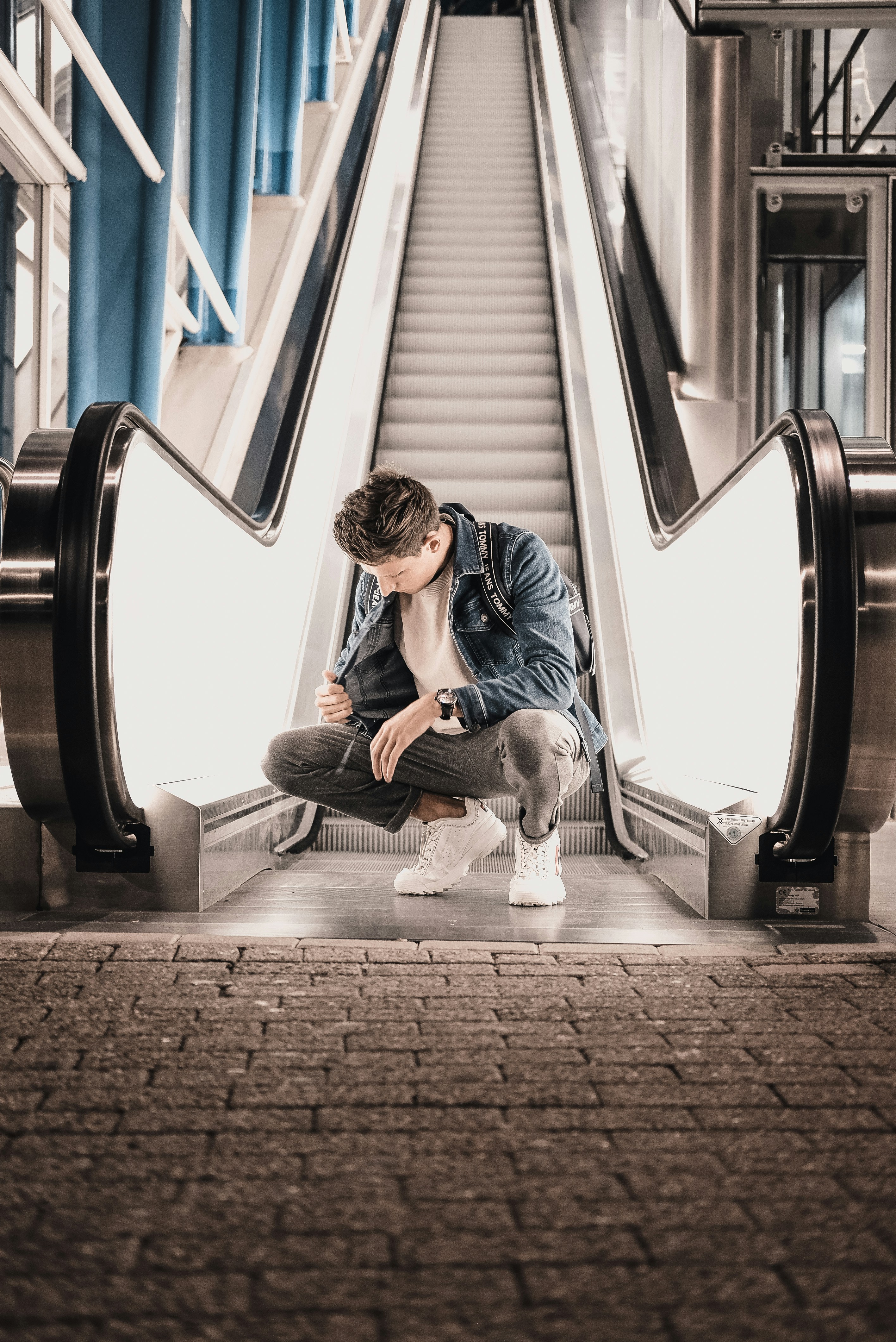 Man sitting near elevator photo – Free Netherlands Image on Unsplash