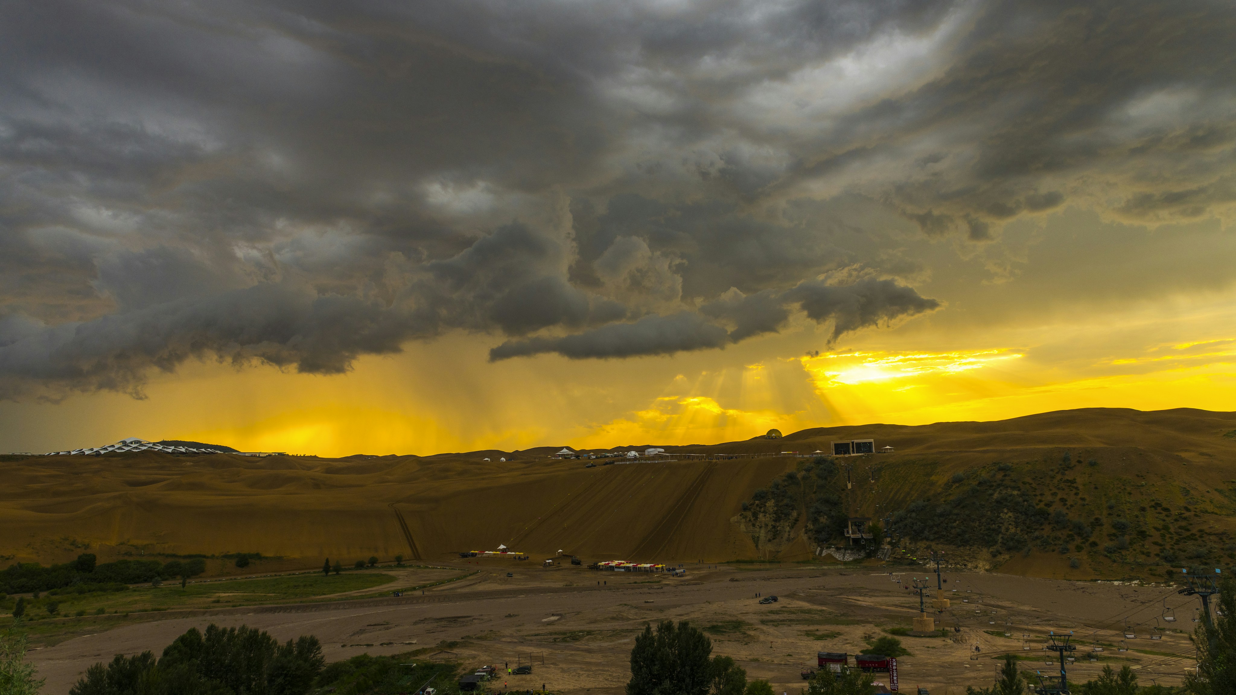 Sunbreak Over the Arid Ridge: Gold Threads in Stormy Skies