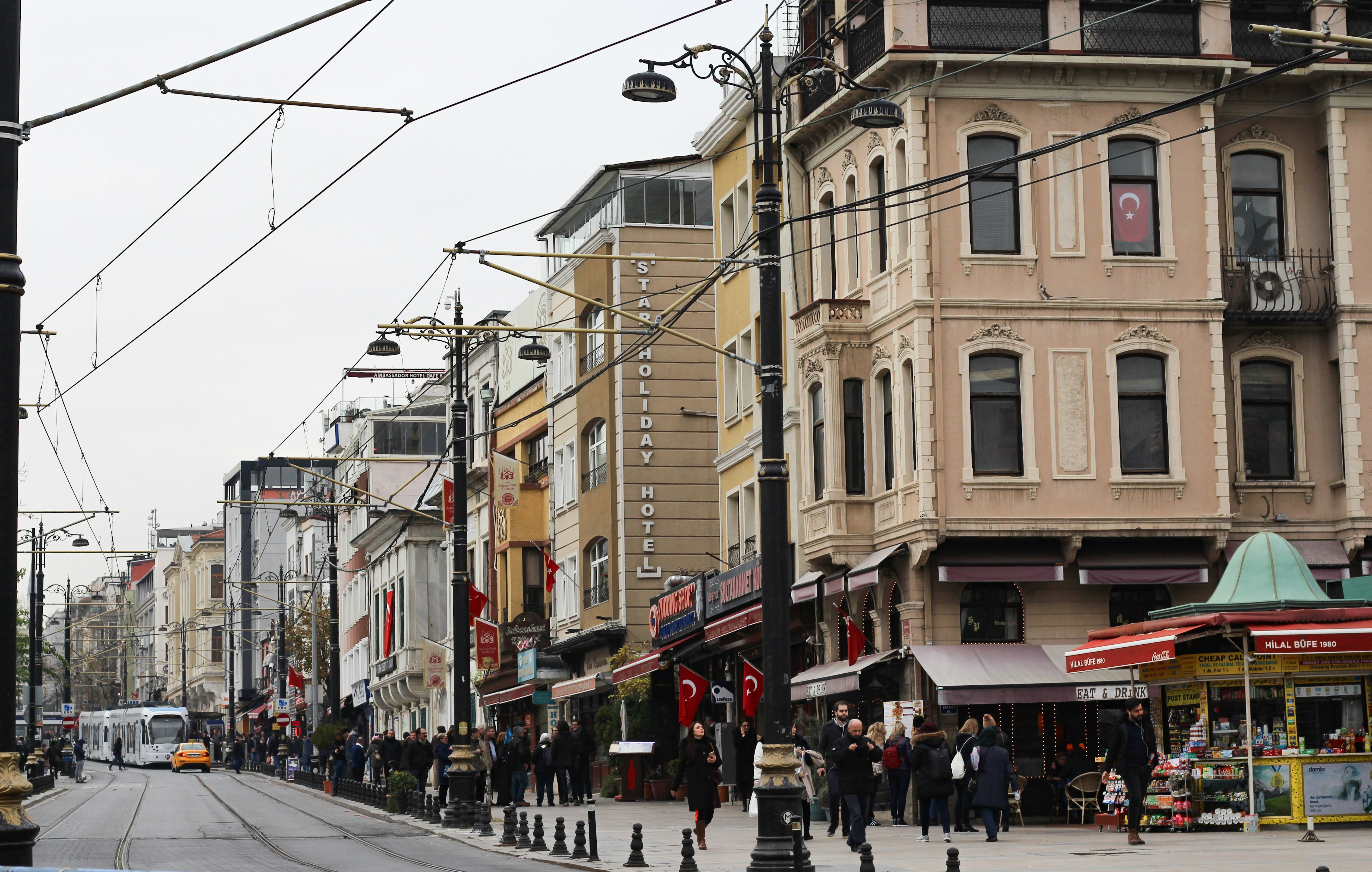 Concrete buildings beside street photo – Free Street Image on Unsplash