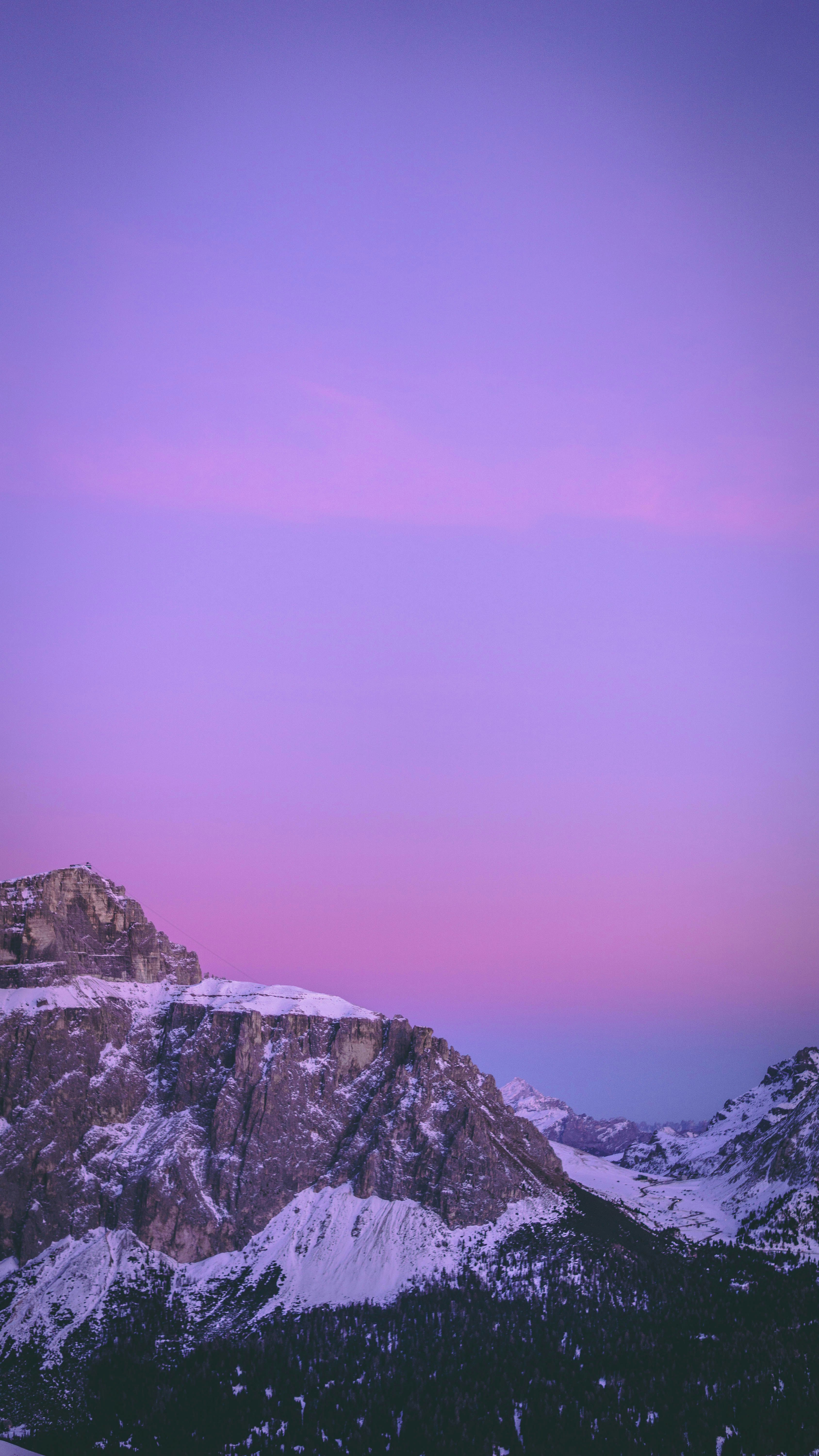 Purple Twilight over Snow-Crowned Alpine Peaks