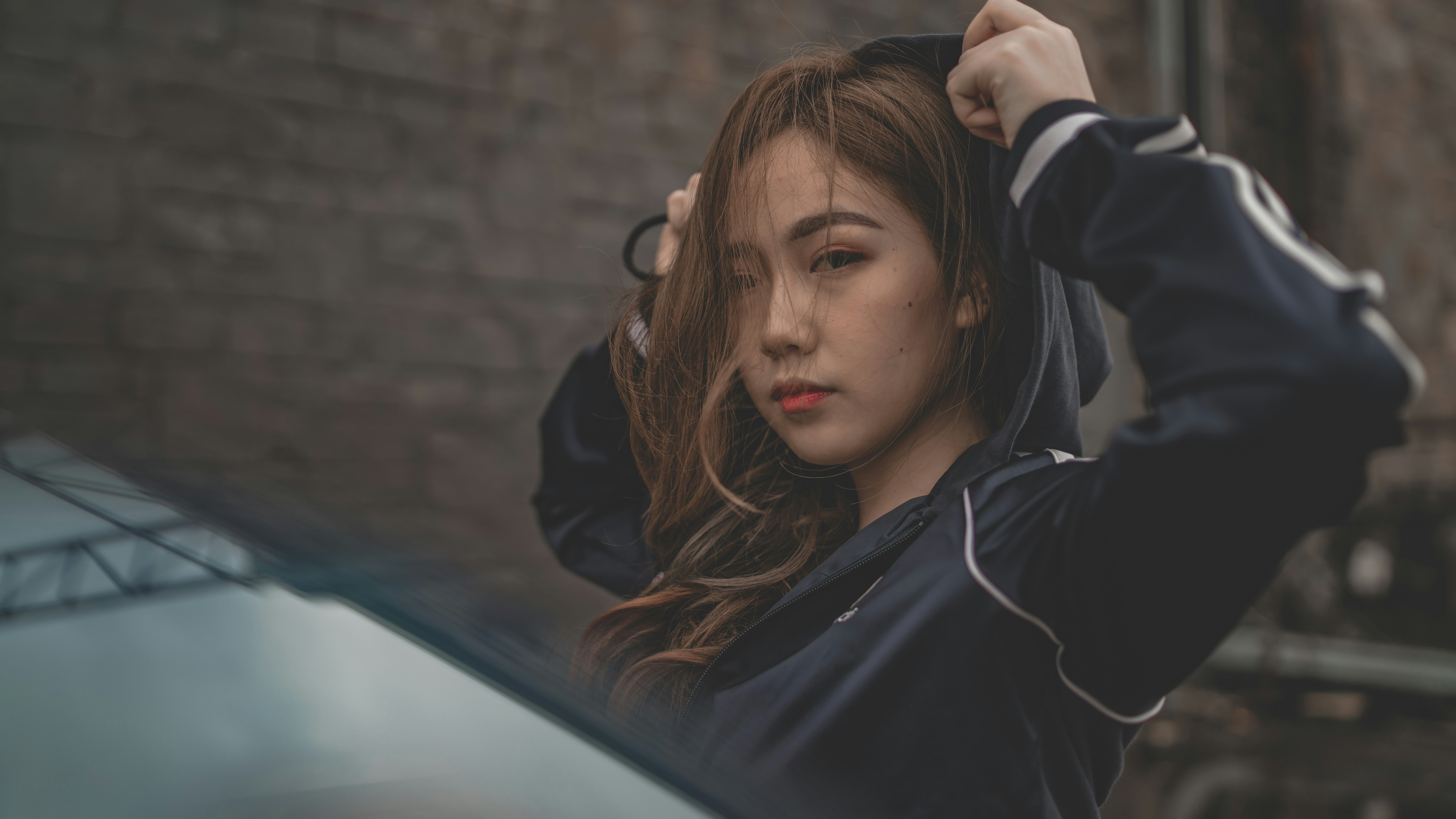 Hooded Gaze Under Urban Light
