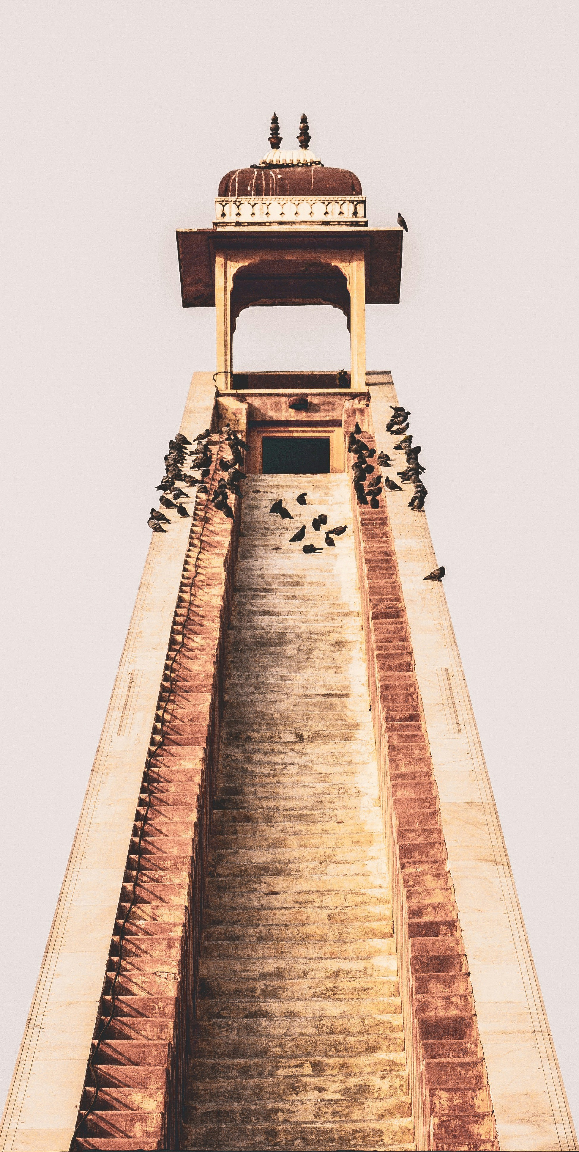 architectural photography of brown and beige staircase