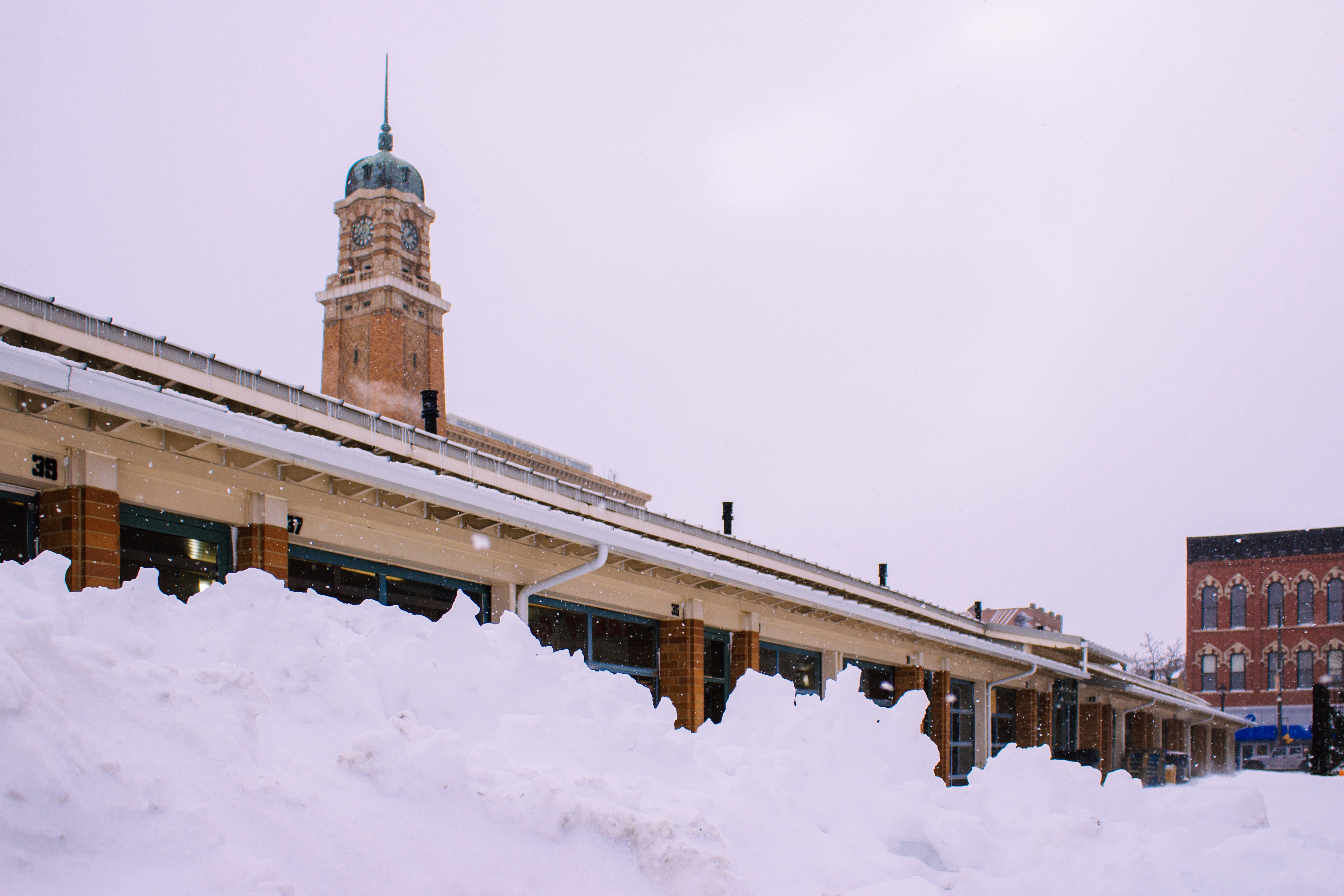 Clock Tower in a Snowbound Street: A Quiet Winter Scene