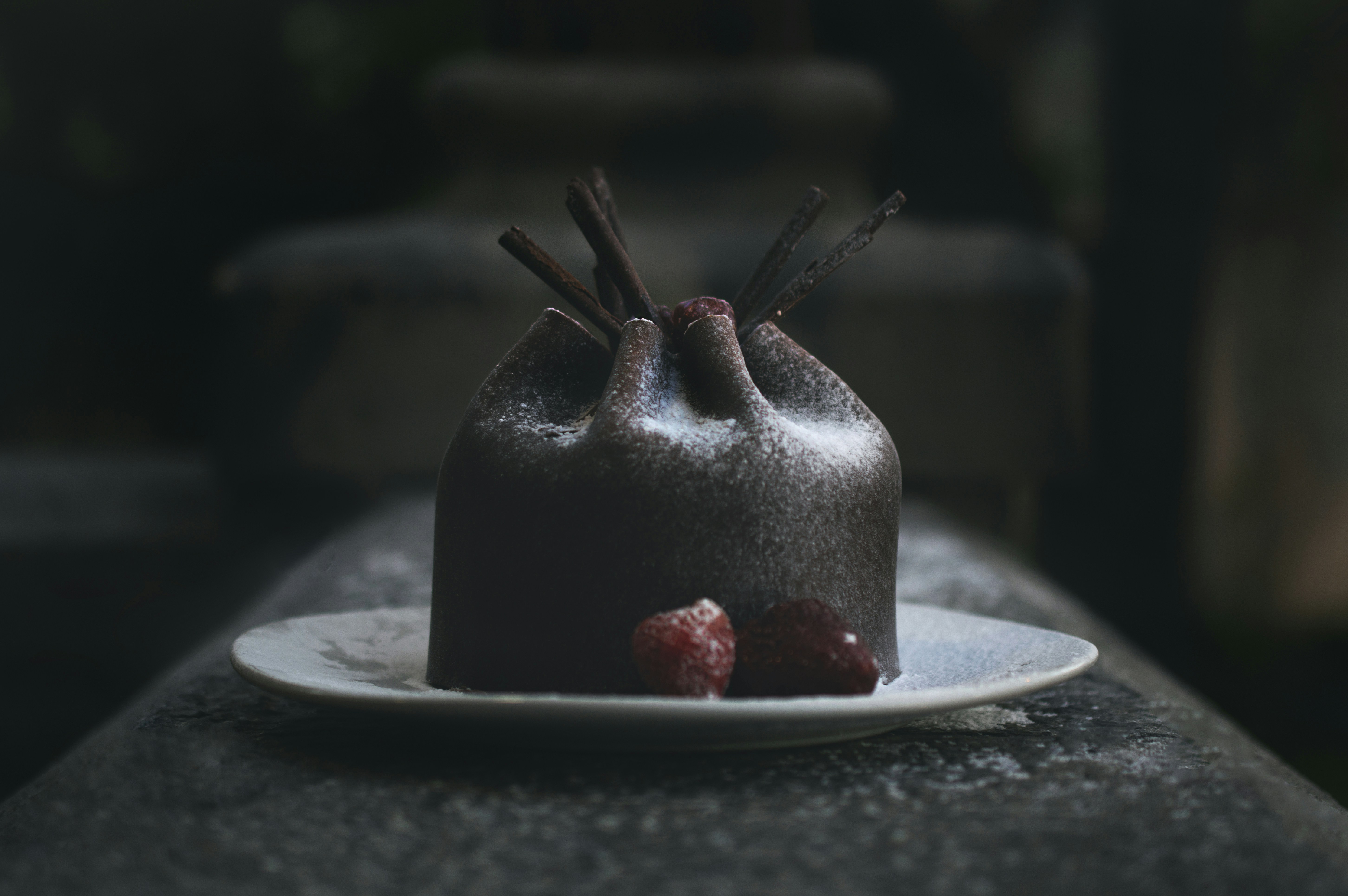 Silky Chocolate Dome with Raspberry Accents on a Quiet Plate