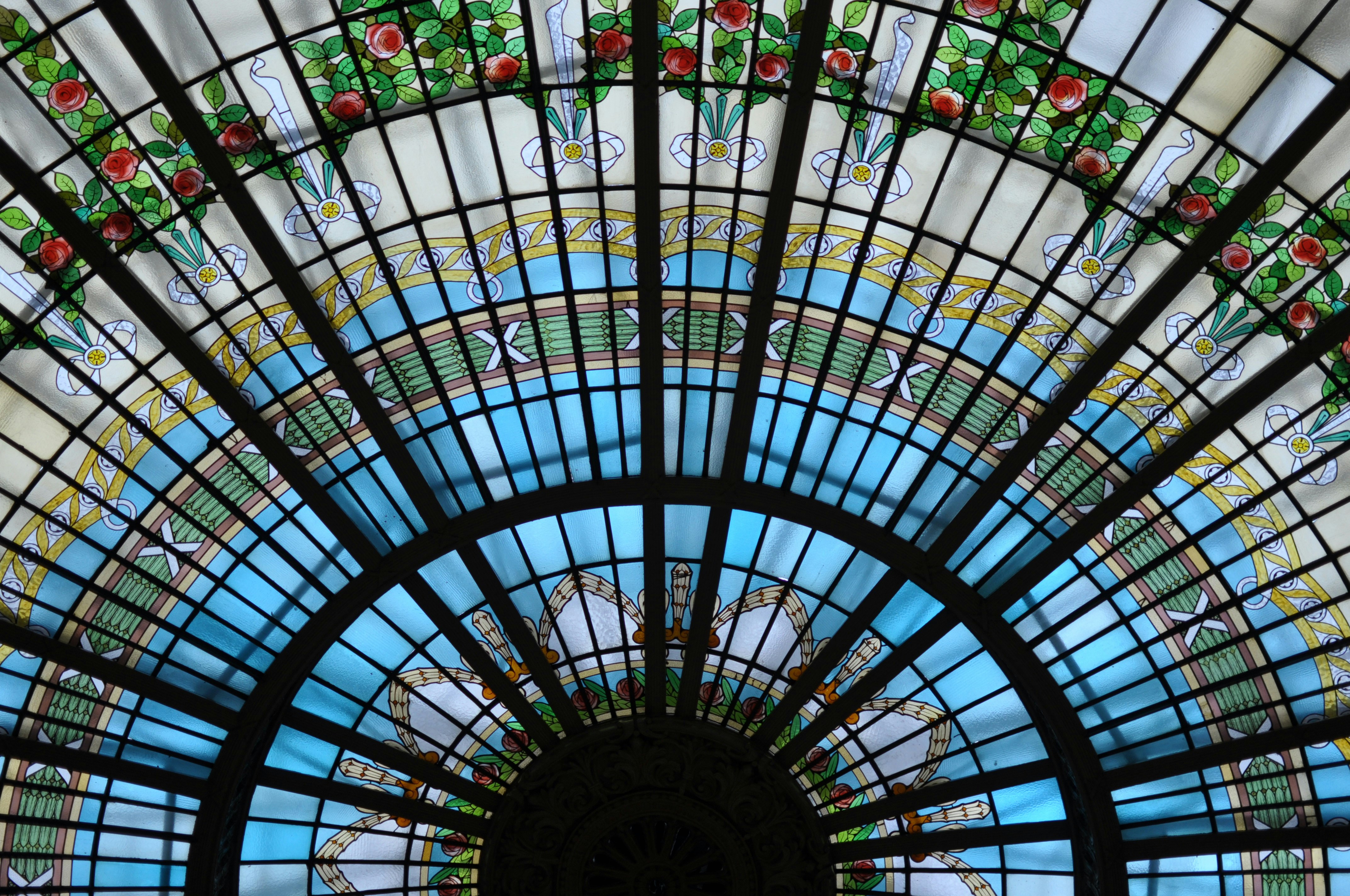 low-angle photography of stained glass dome