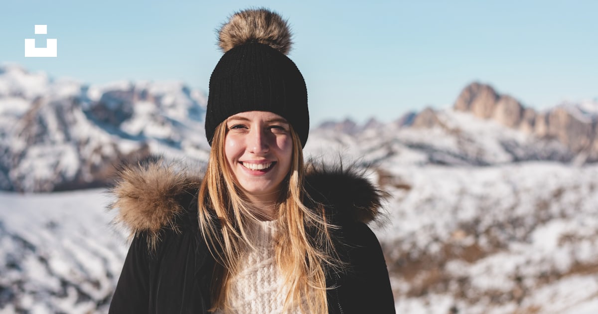 Smiling Woman Standing While Wearing Black And Brown Parka Coat Photo