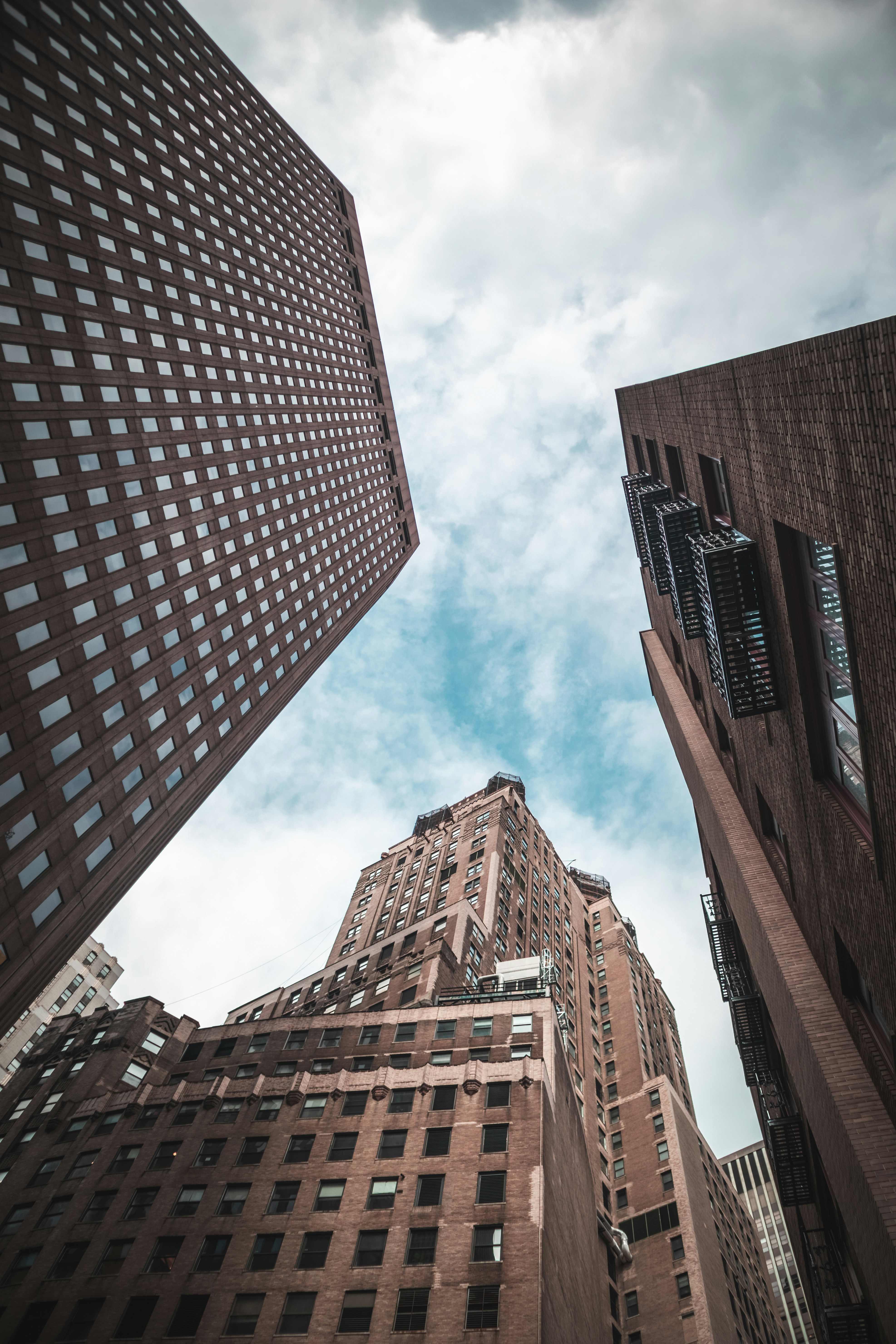 High-angle photography of brown high-rise buildings during daytime ...