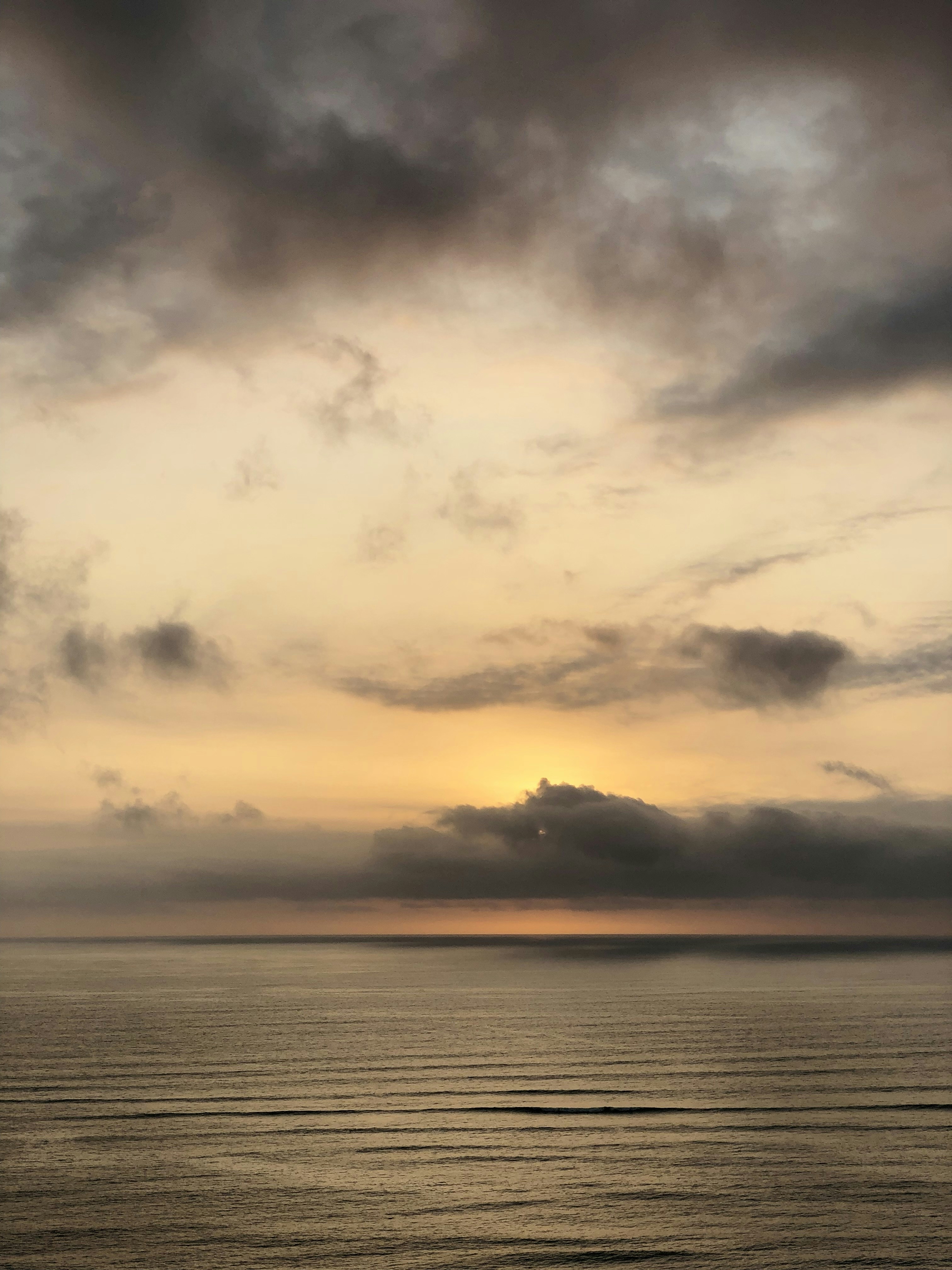 Horizon Ember Over a Rippling Sea at Dusk