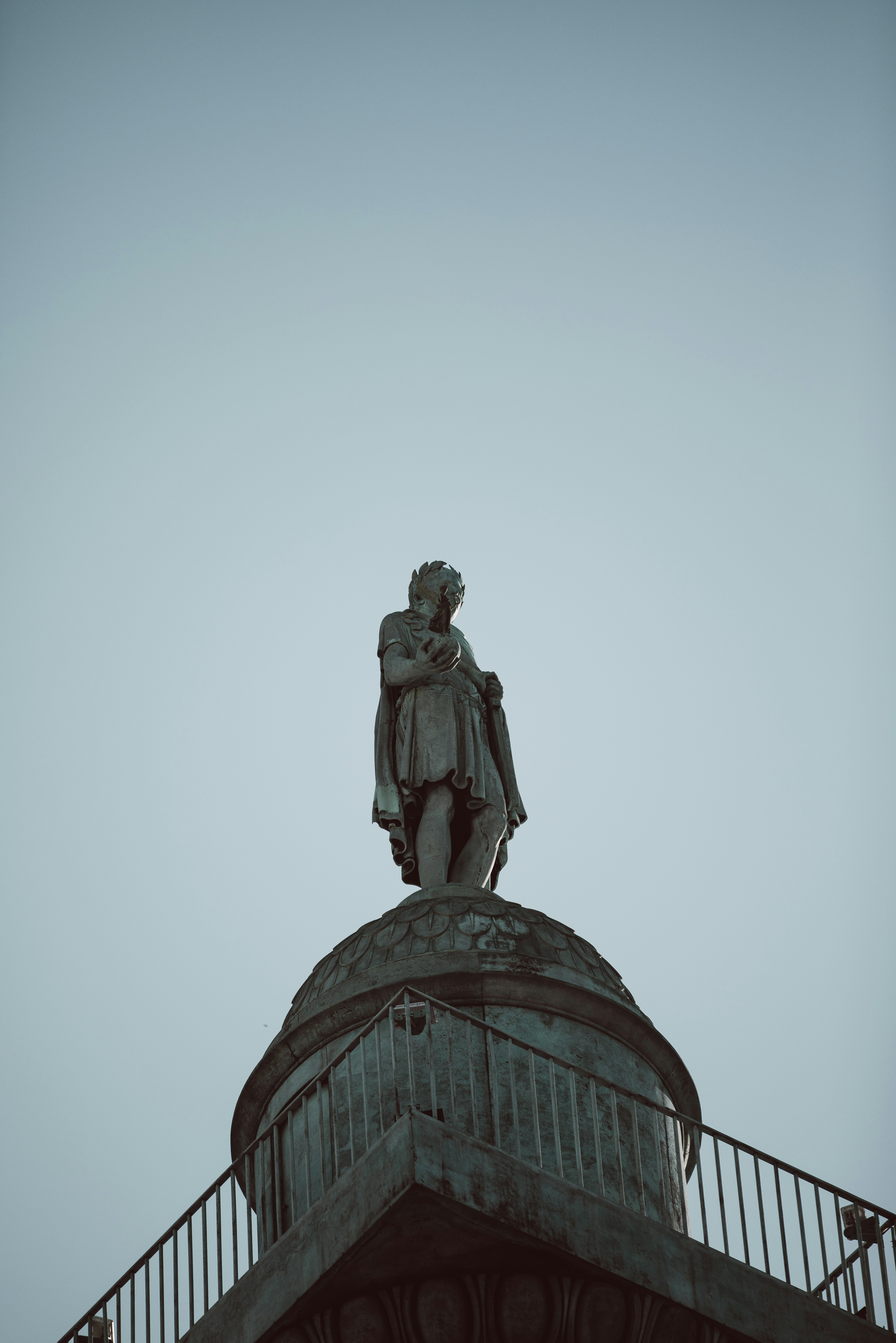 a statue of a man on top of a building
