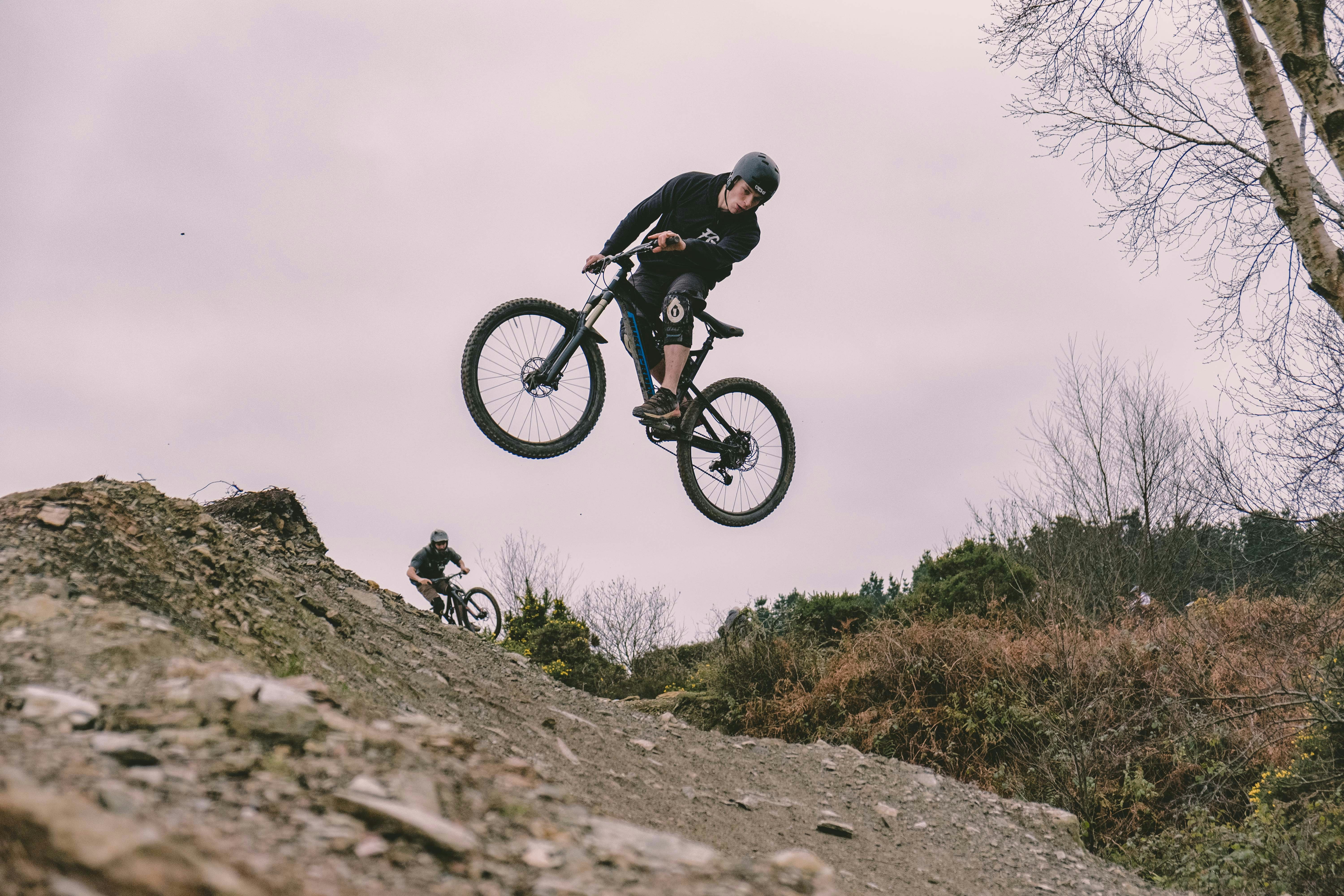 Man riding mountain bike by slope during daytime photo – Free Mountain ...