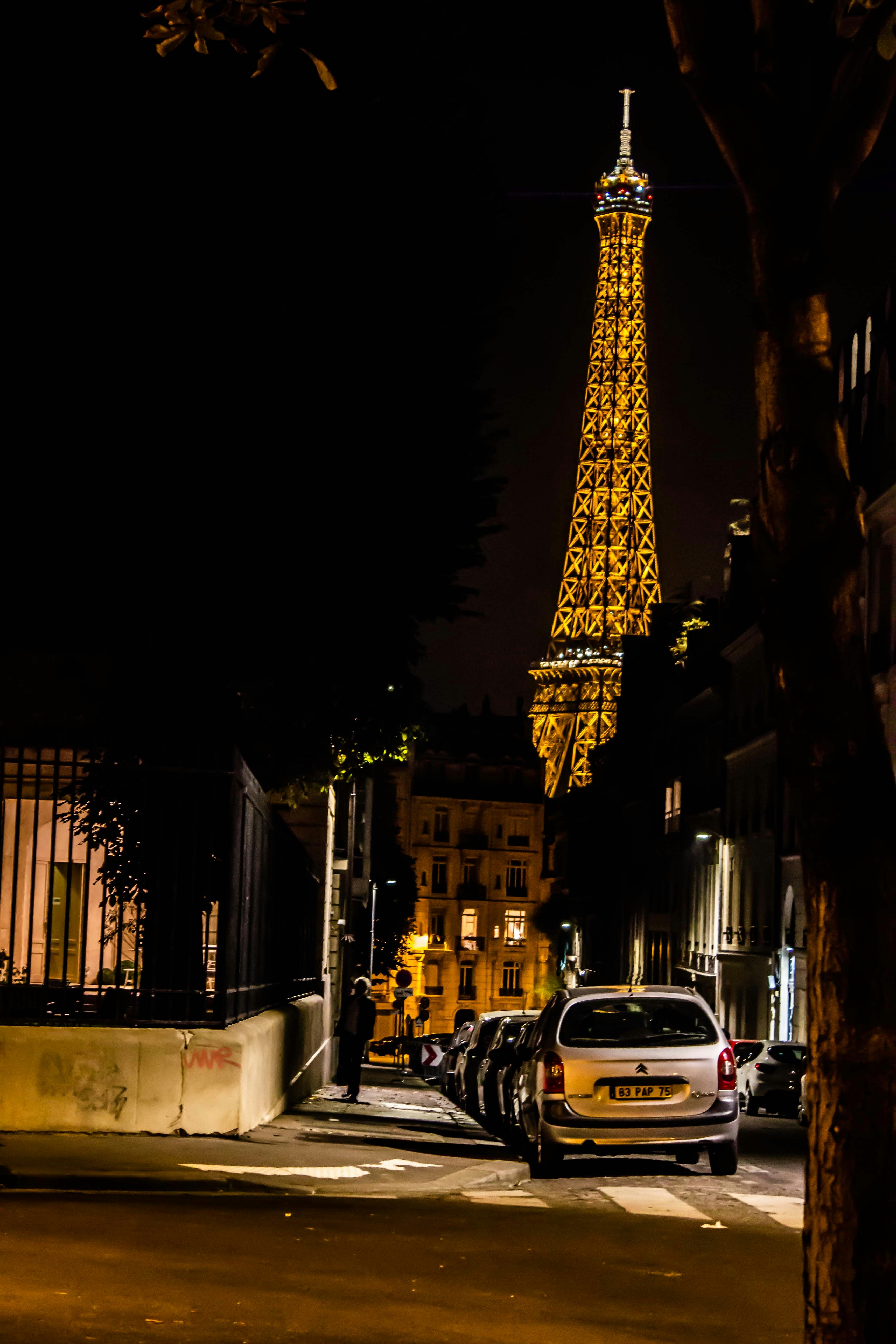 Vehicles parked on roadside near Eiffel Tower at night photo – Free ...