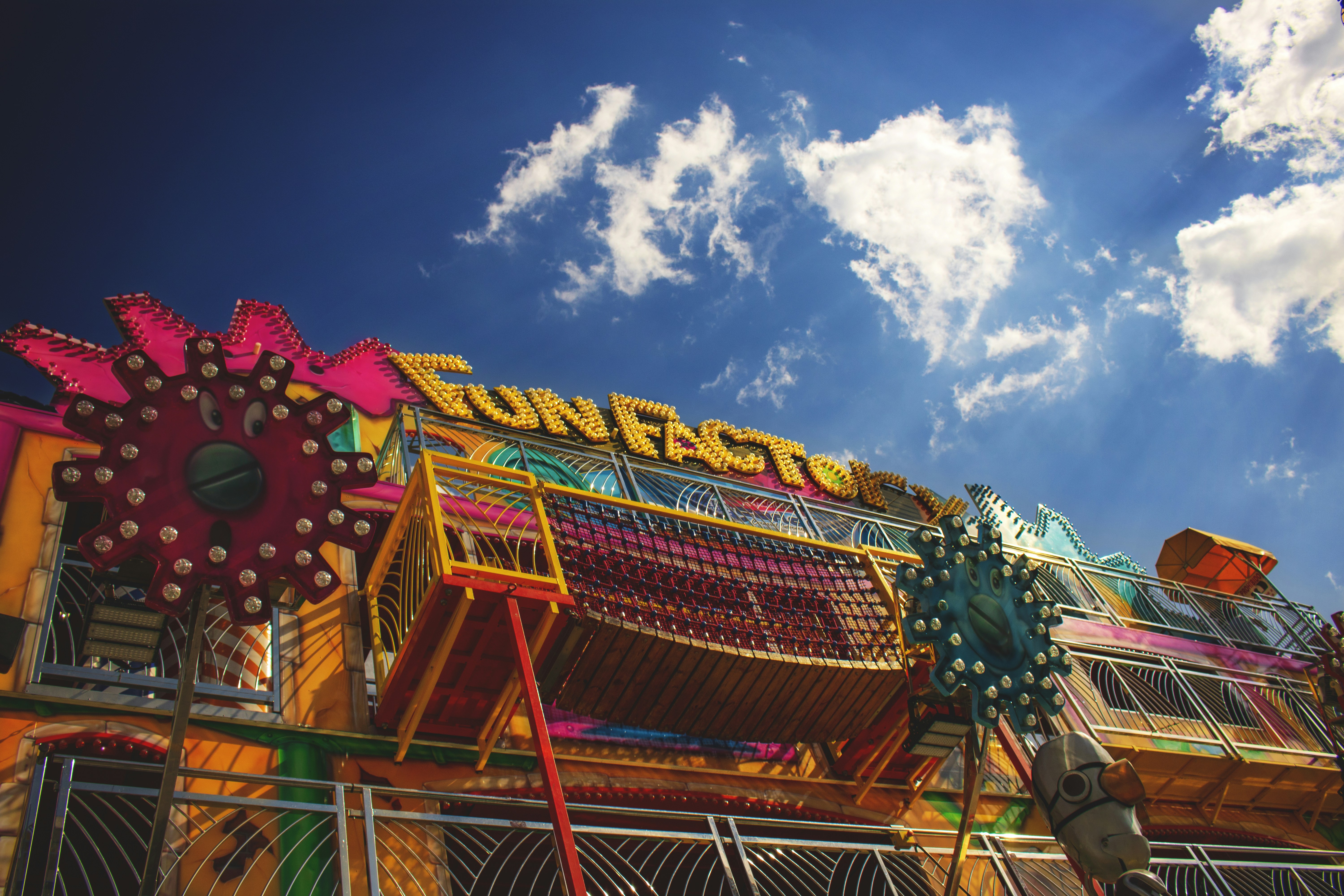 Neon Starbursts Over a Carnival Façade