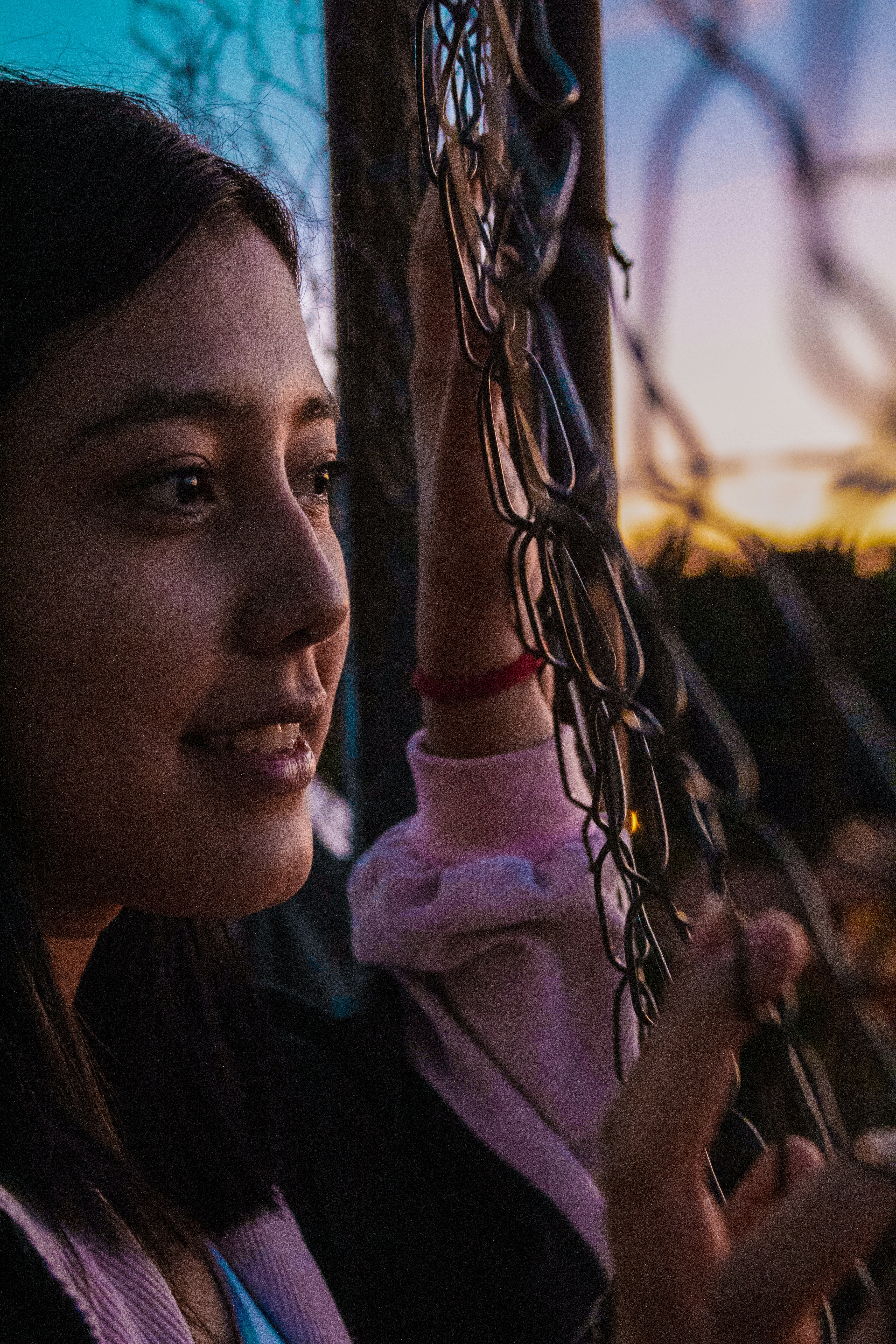 Dusk Gaze by the Chain-Link Fence: A Portrait Study