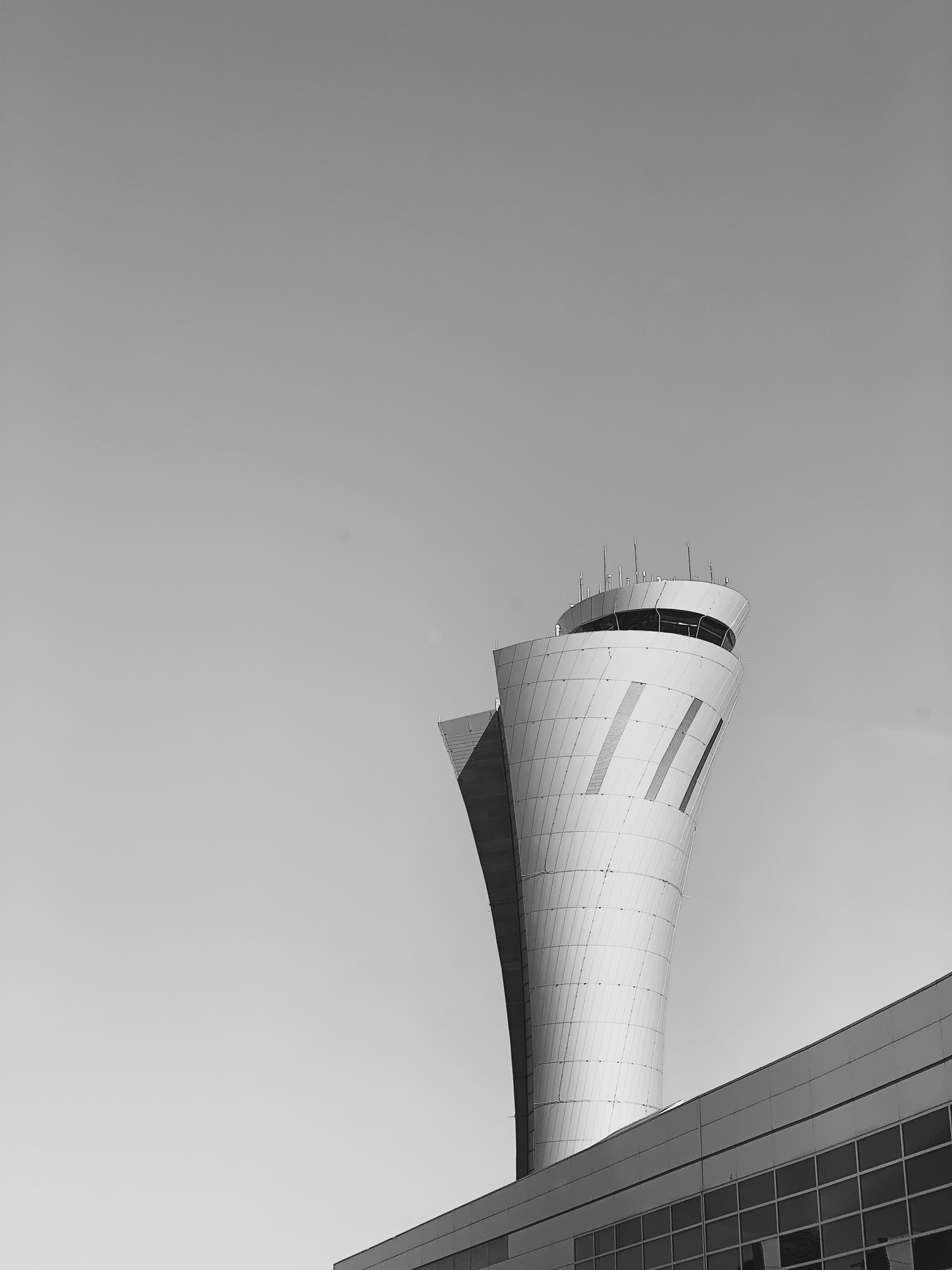 white and gray concrete building under white sky during daytime
