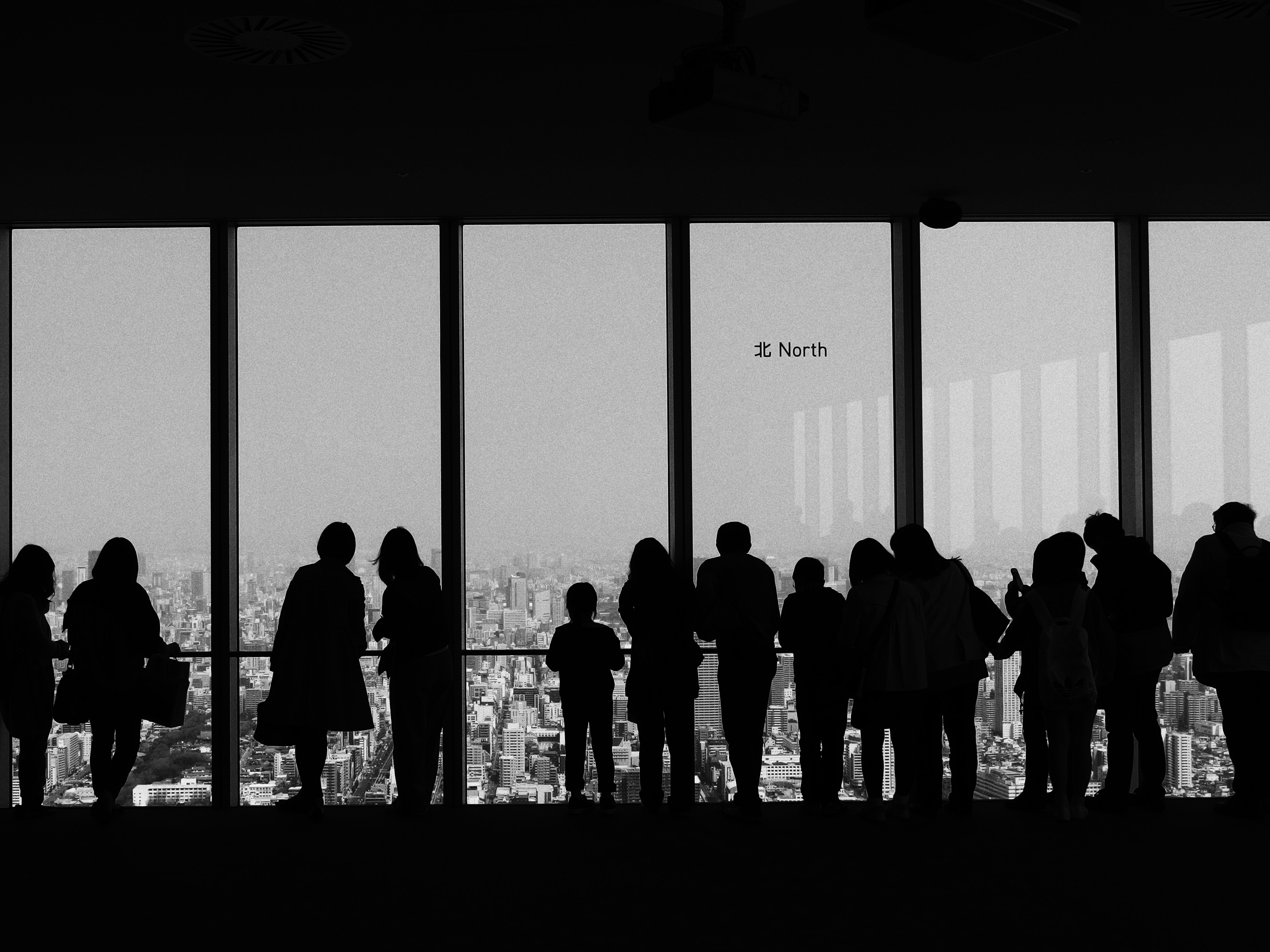 People overlooking buildings inside room photo – Free Grey Image on ...