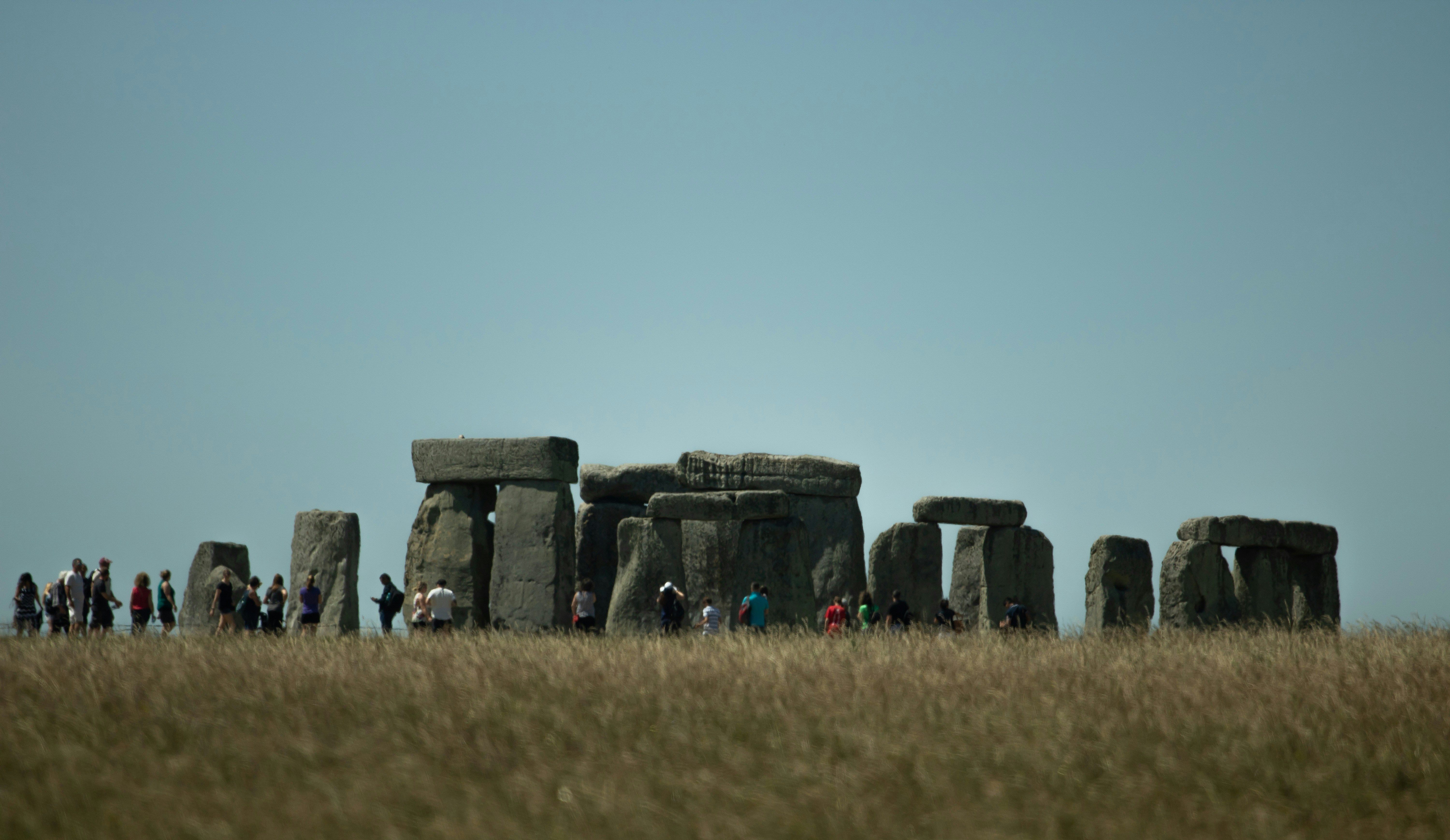 People on rock formation during daytime photo – Free Stonehenge Image ...