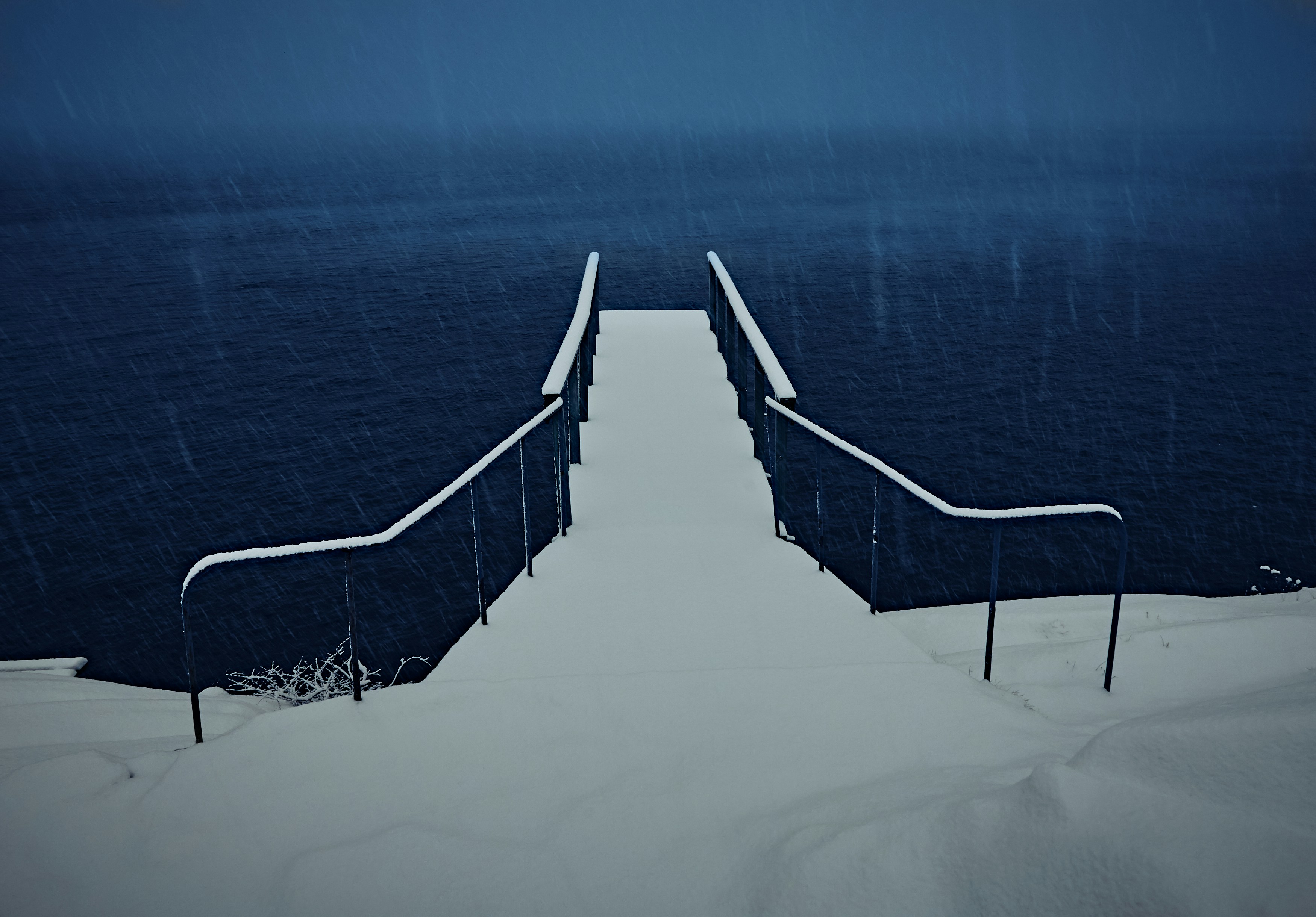 Snow covered stairs and dock near body of water photo – Free Grey Image ...