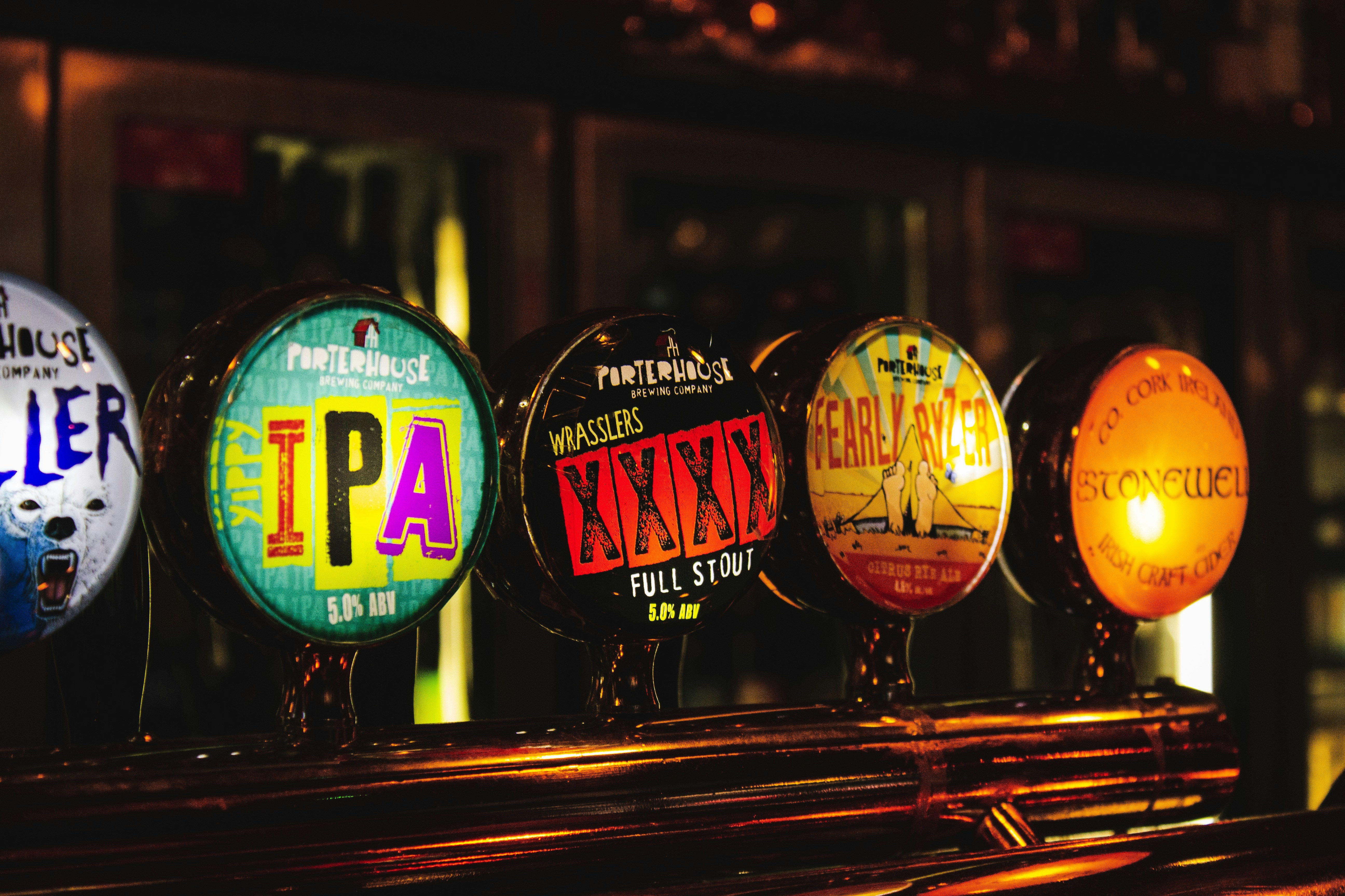 Colorful Tap Handles in a Neon-lit Bar