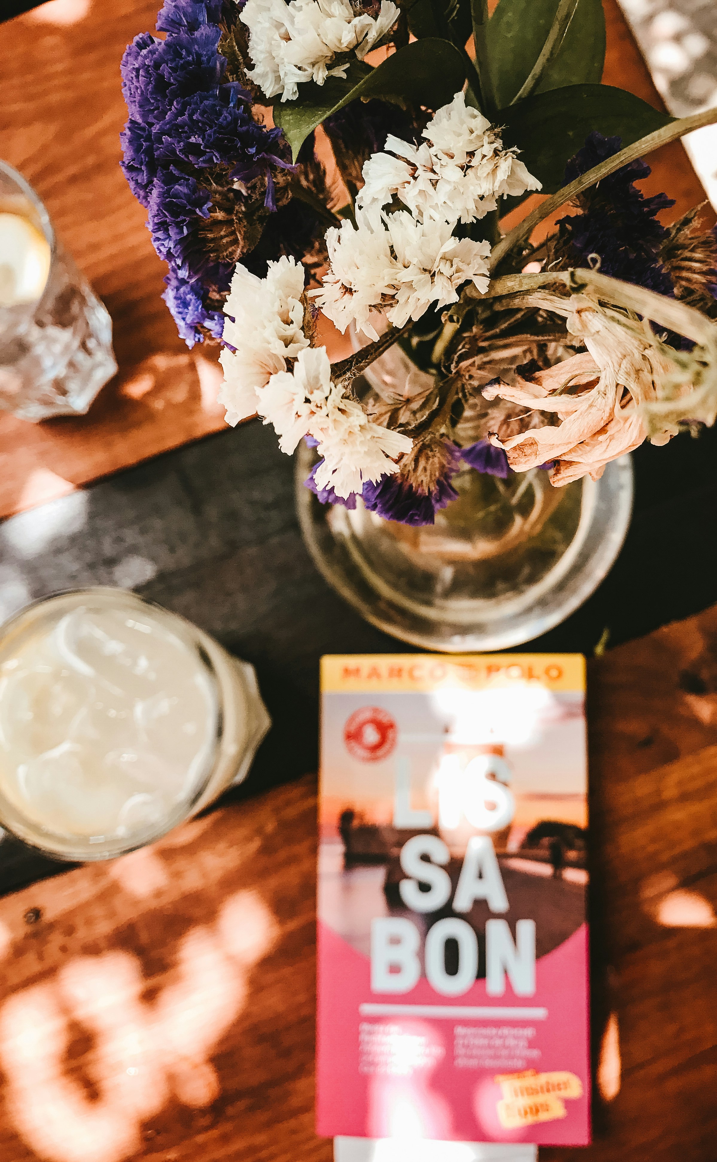 Bouquet and Sunlit Card on a Wooden Table