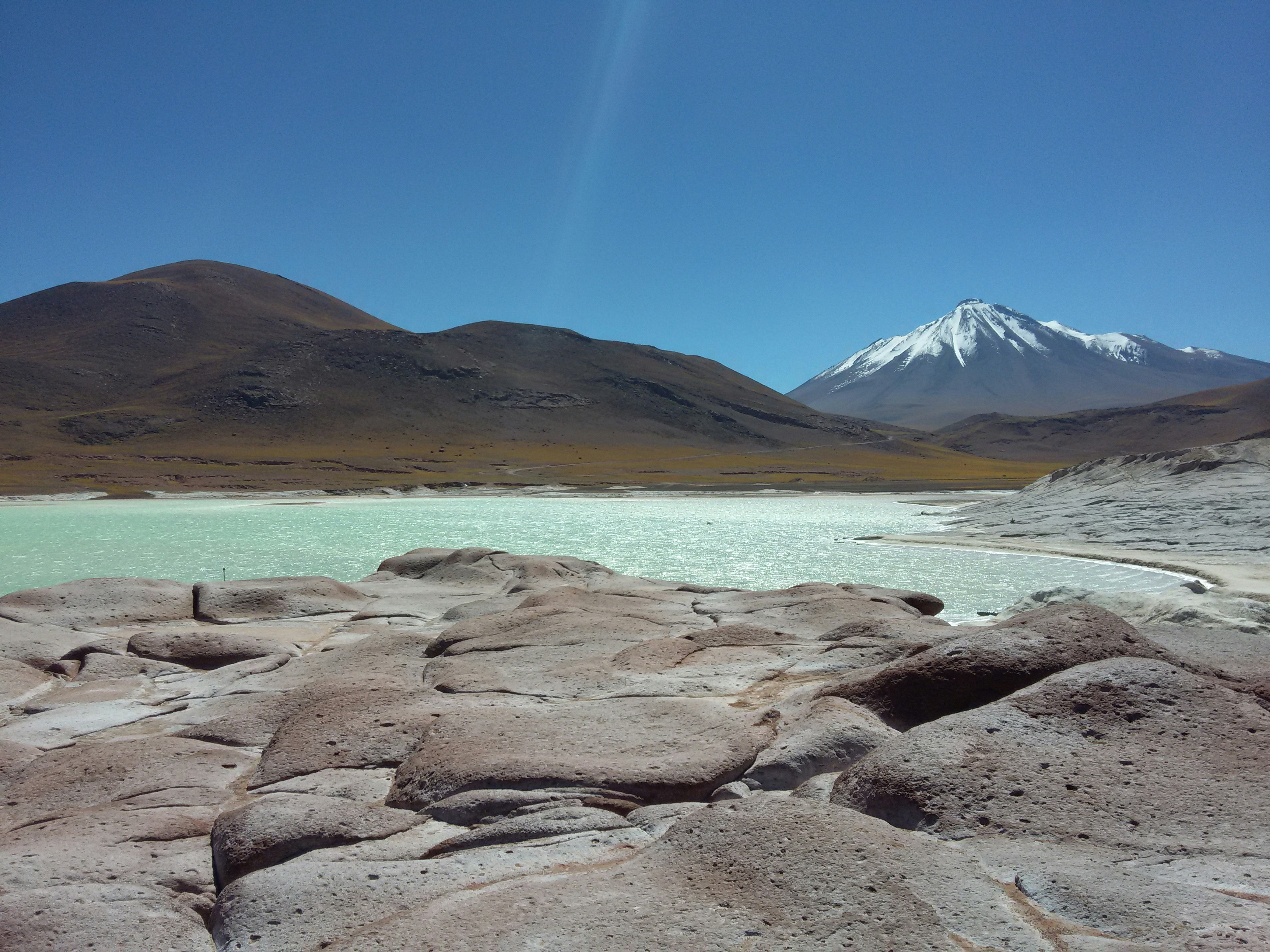 Teal Basin Beneath Snow-Crowned Peaks