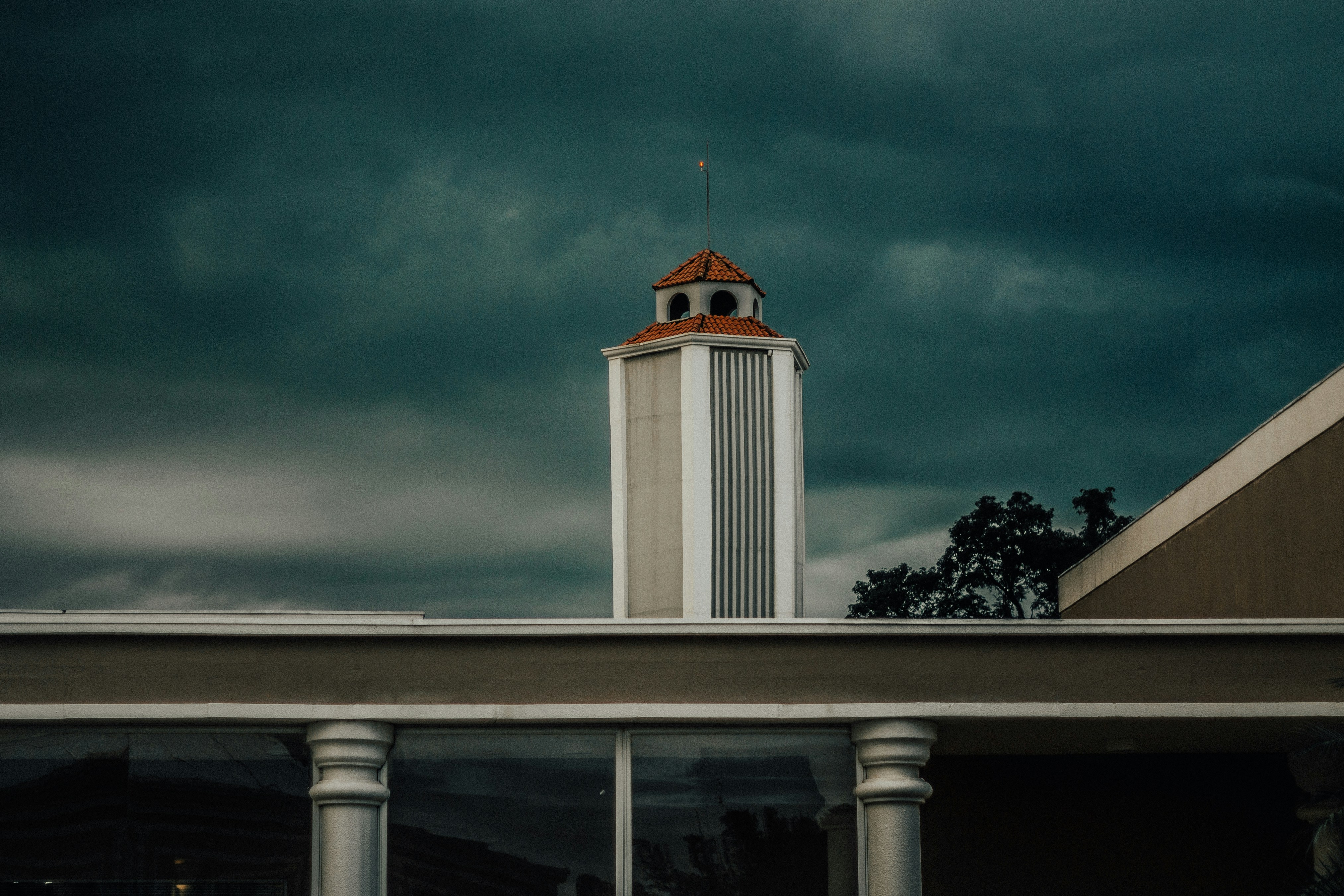 Stormy Skies Over Modern Tower