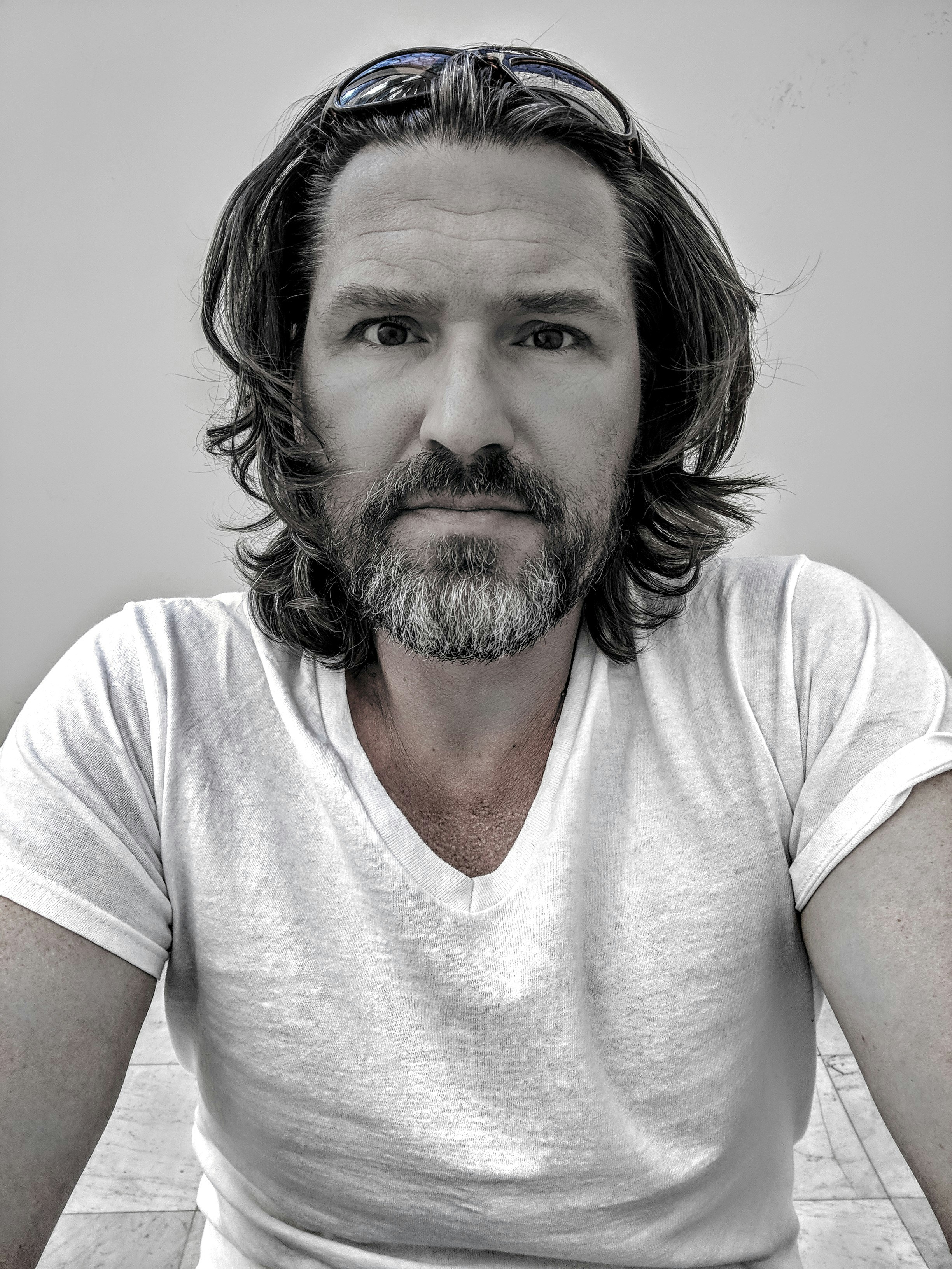 Man taking selfie beside white painted wall photo – Free Grey Image on ...