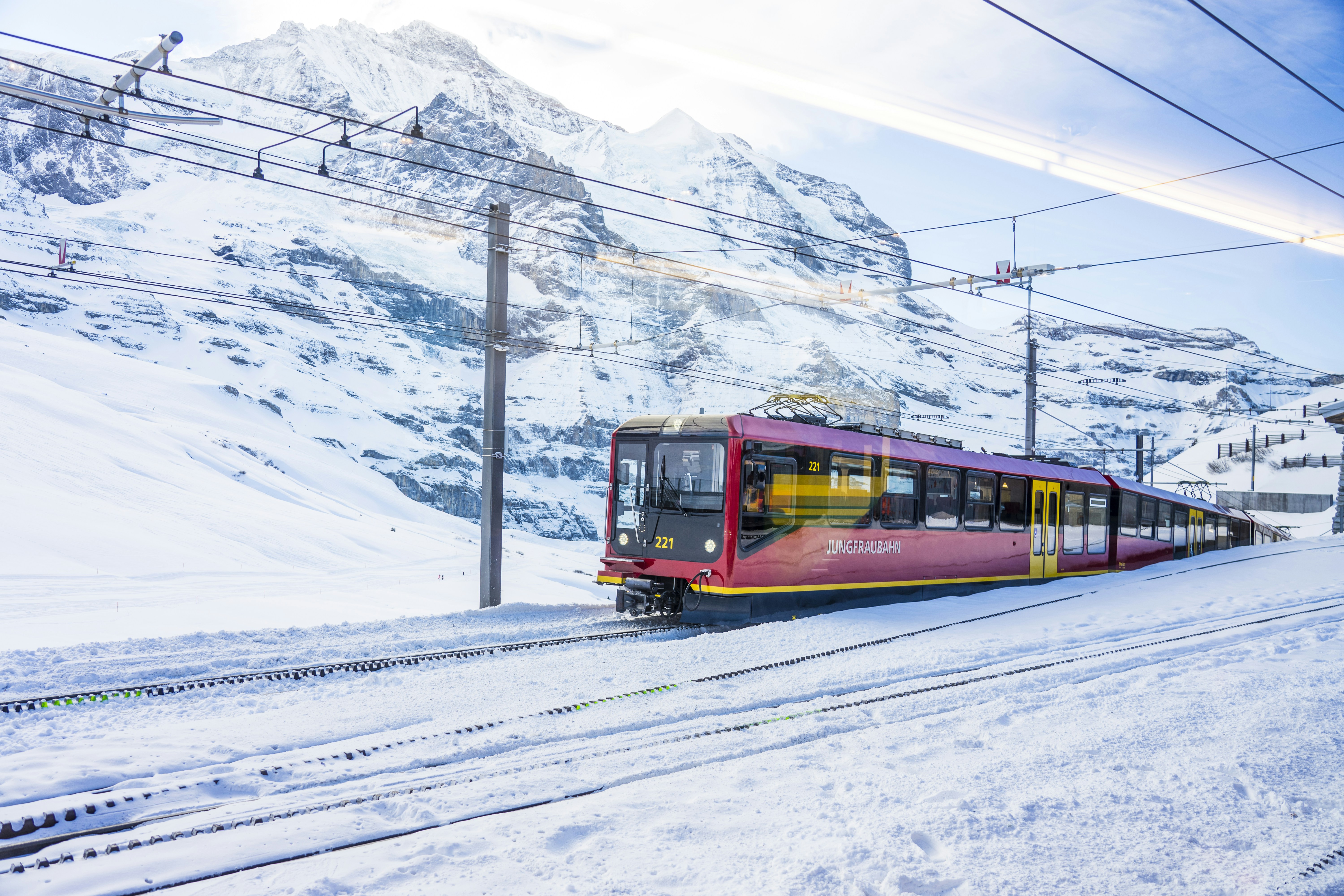 Pink train passing by snow covered mountains near daytime photo – Free ...