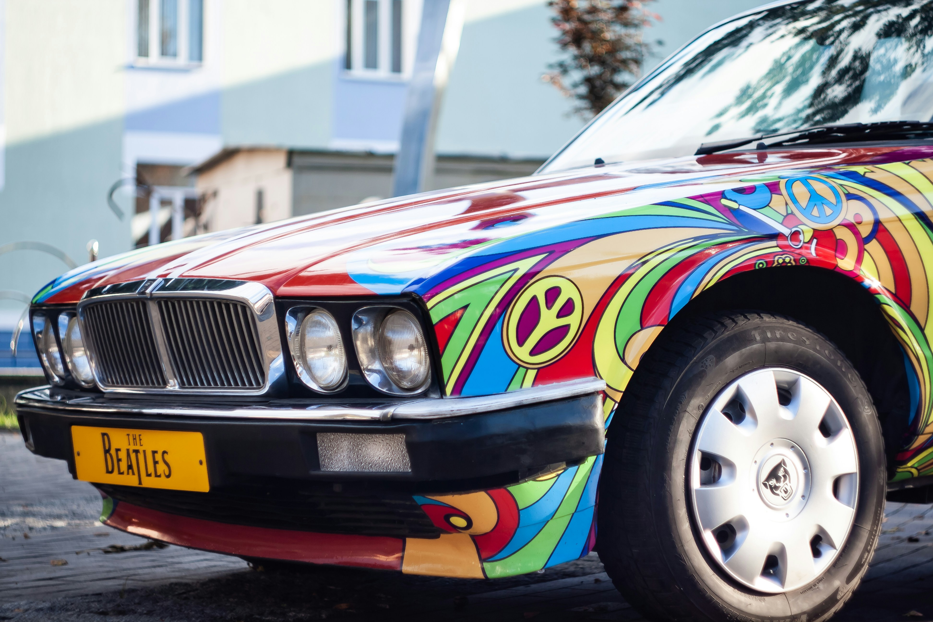Psychedelic Street Star: A Beatle-era Car with Bold Graffiti Palette