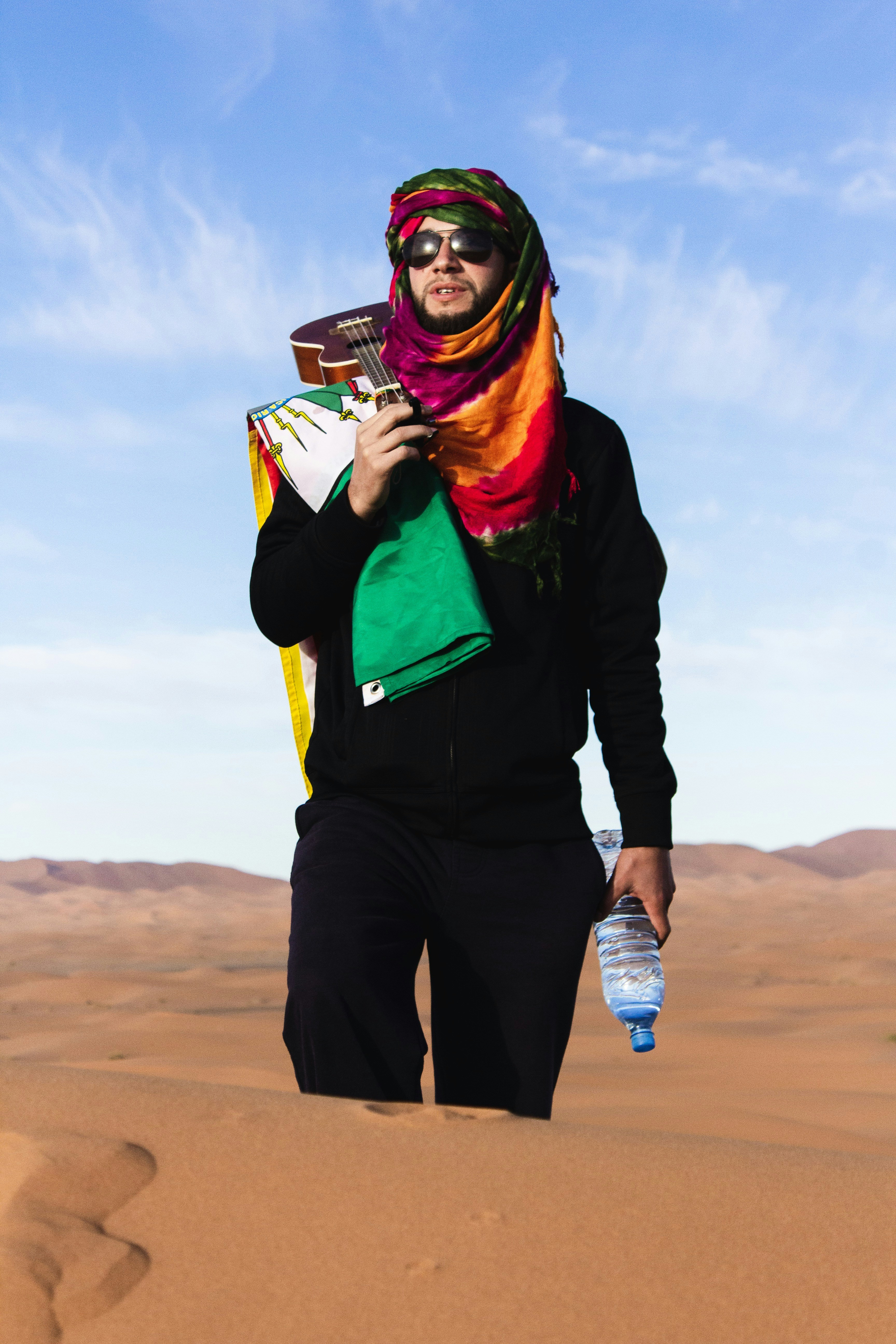 Rainbow Veil in the Dunes: A Desert Traveler with a Ukulele