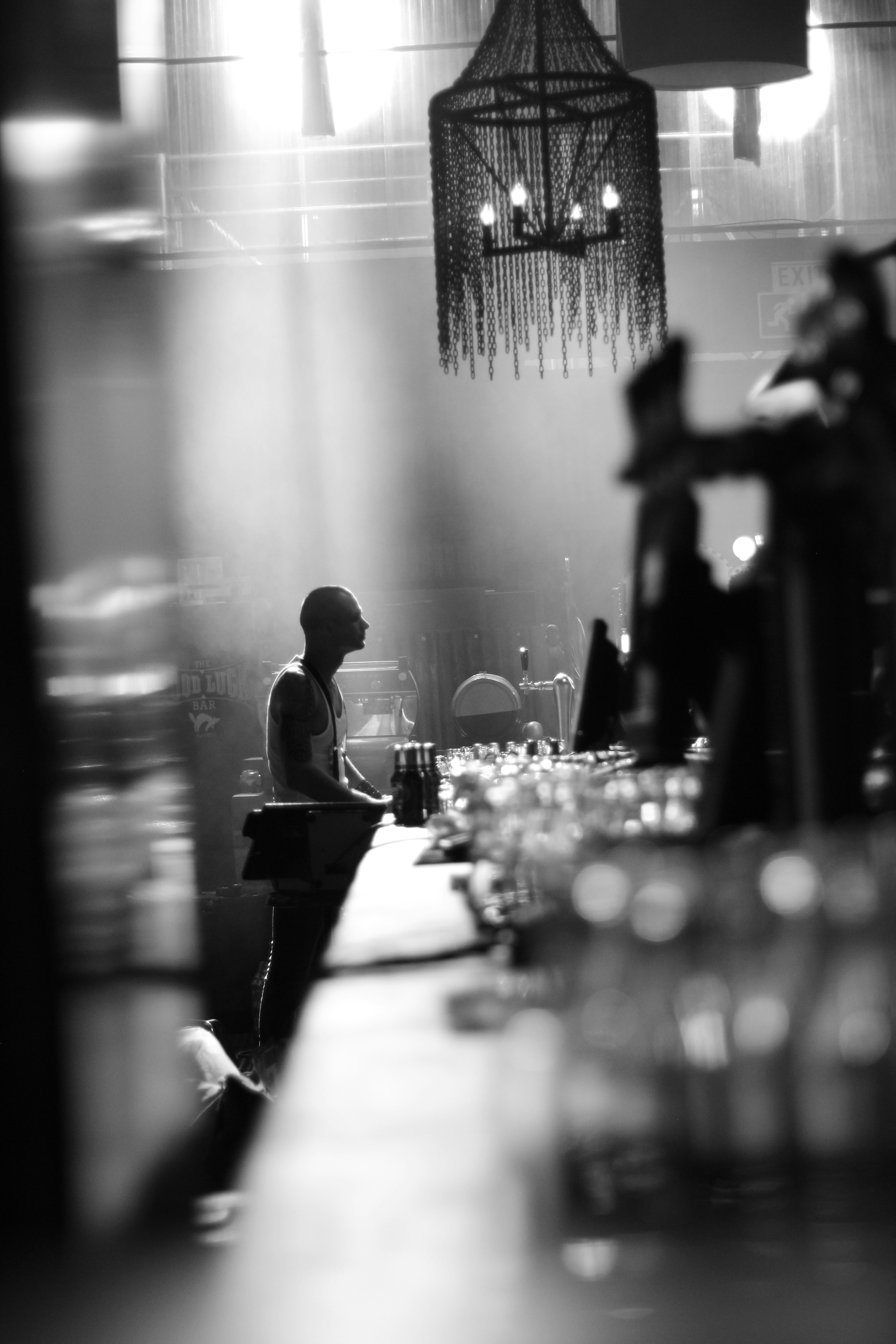 A Silent Bartender Under Soft Spotlight