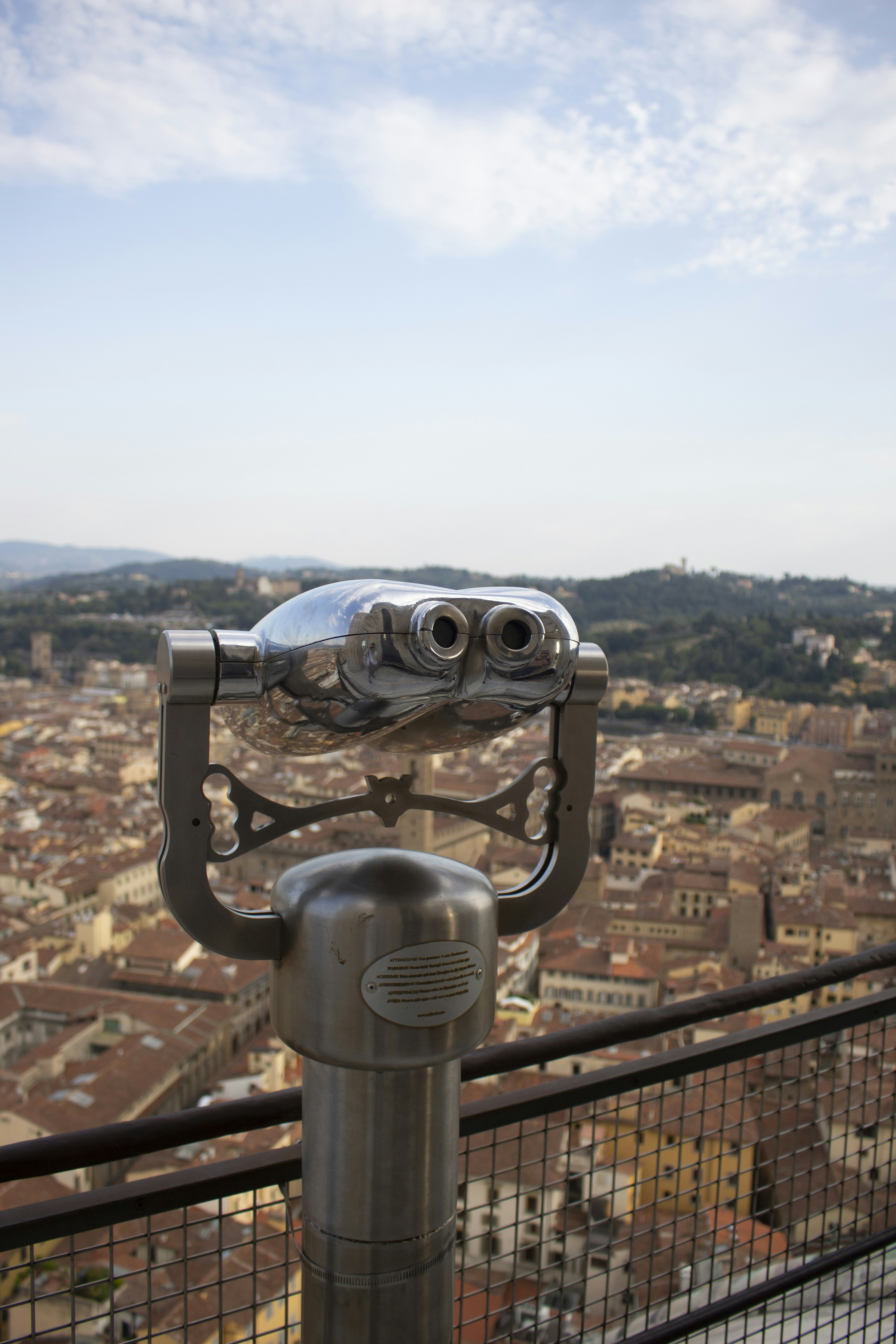 Coin-Operated Sentinel Over Terracotta Cityscape