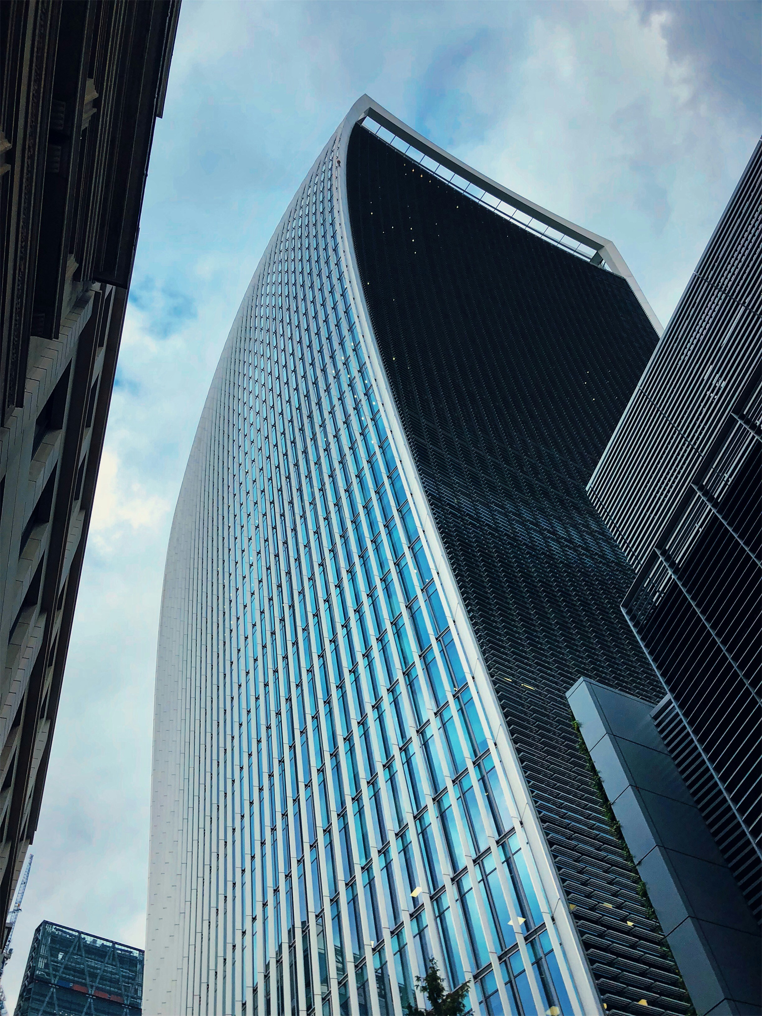 Low-angle photography of curtain wall high-rise building during daytime ...