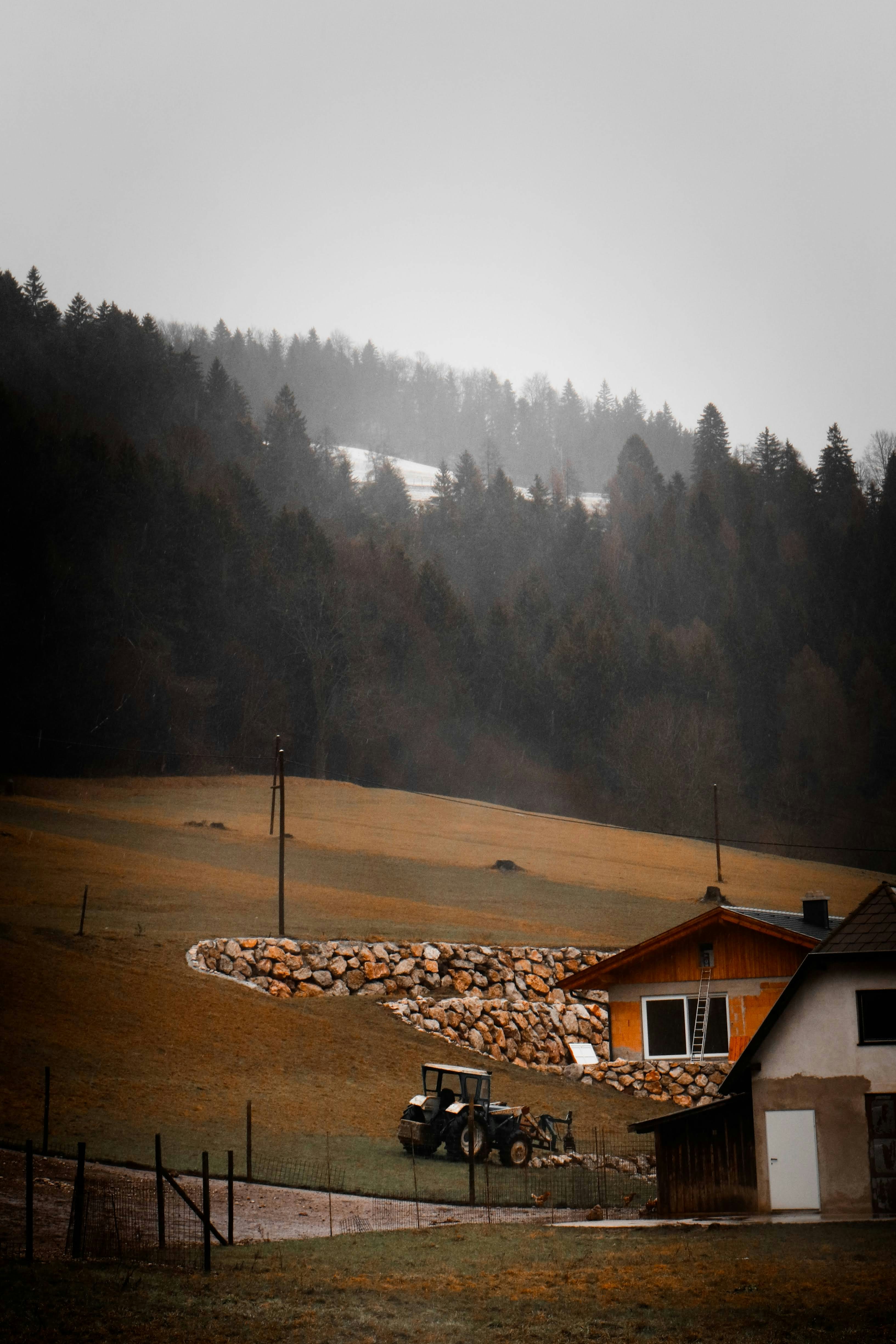 Tractor at the Edge of Mist: A Mountain Farmstead