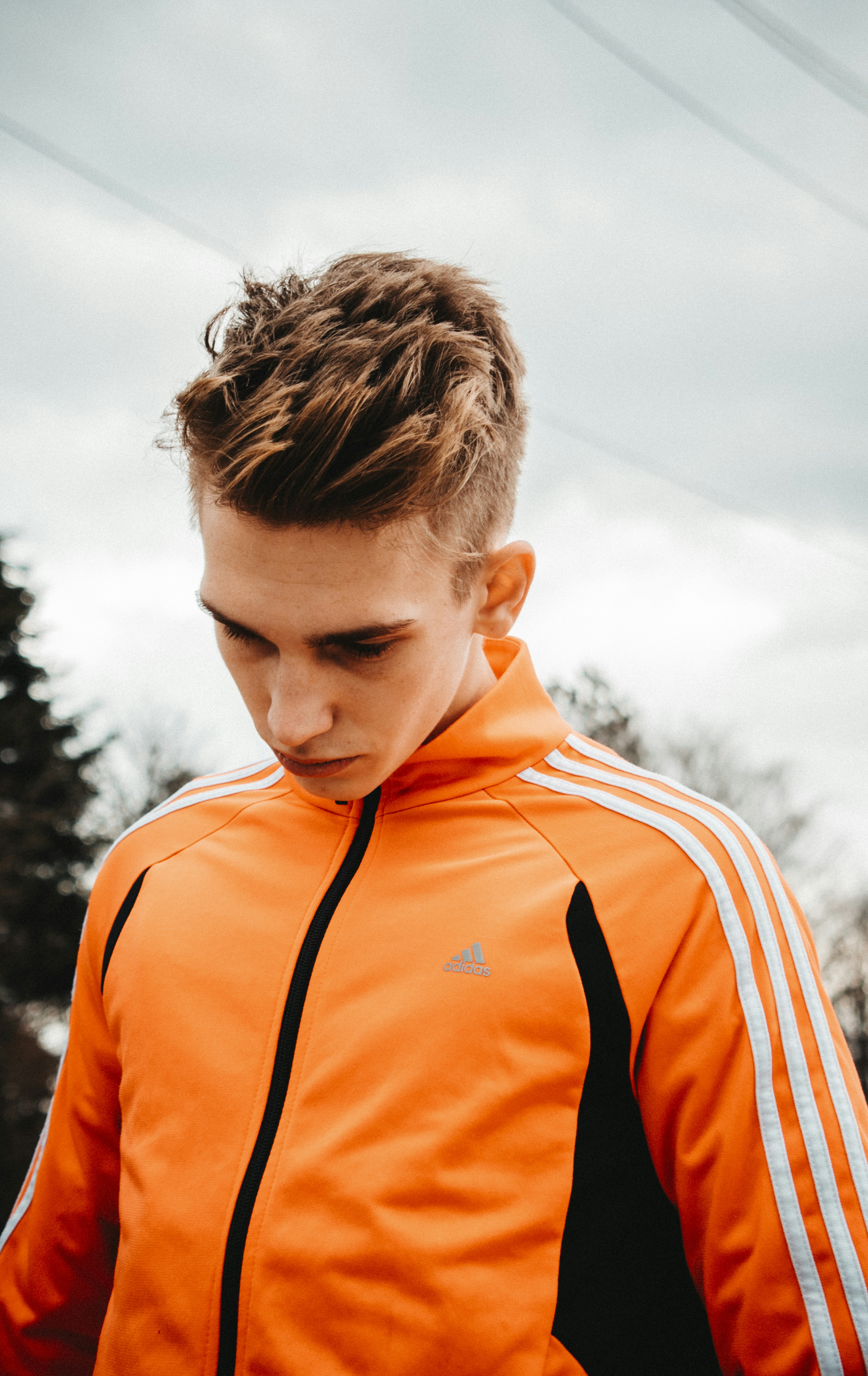 man in orange jacket