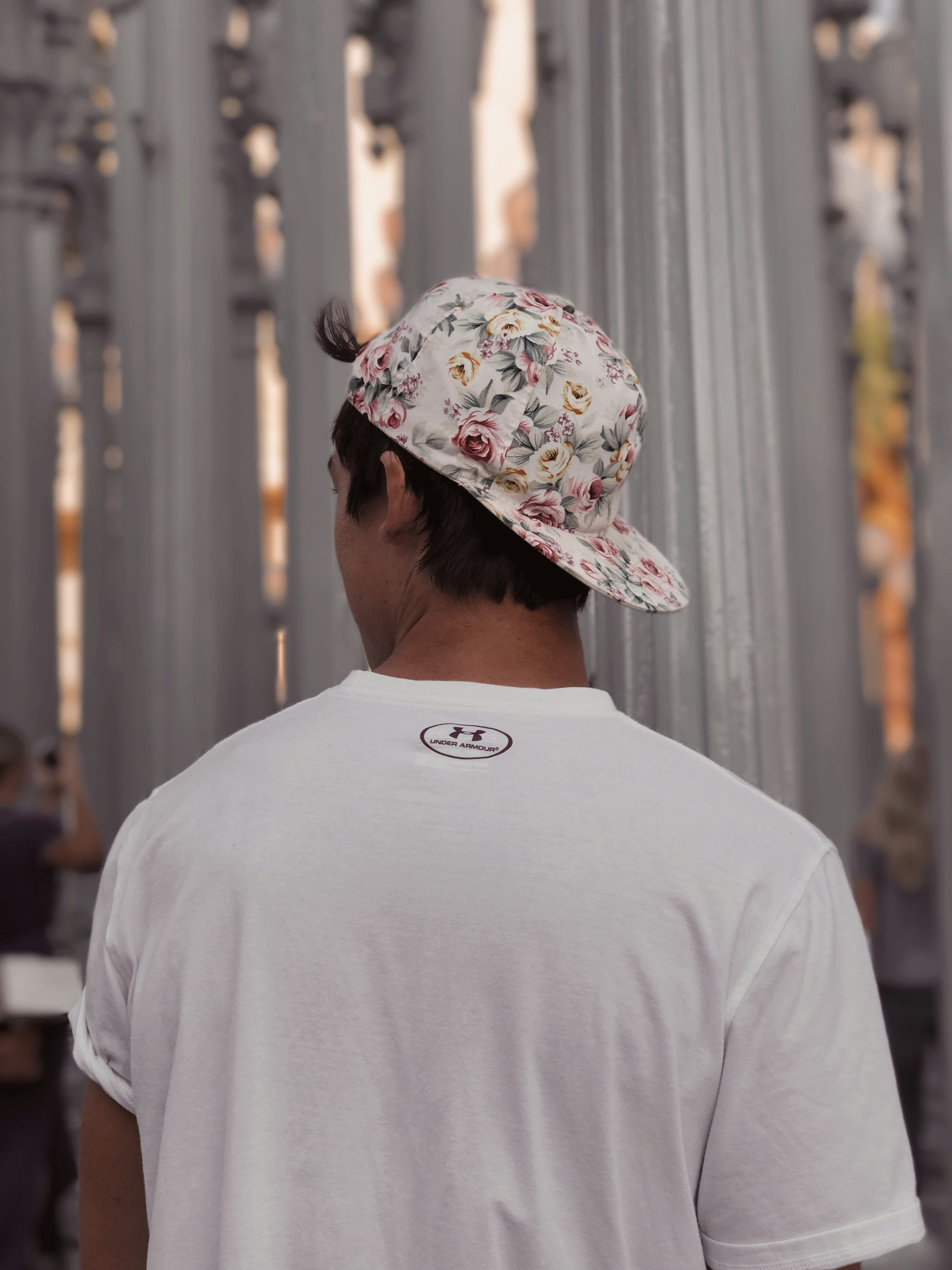 Floral Cap in a Sunlit Corridor of Columns