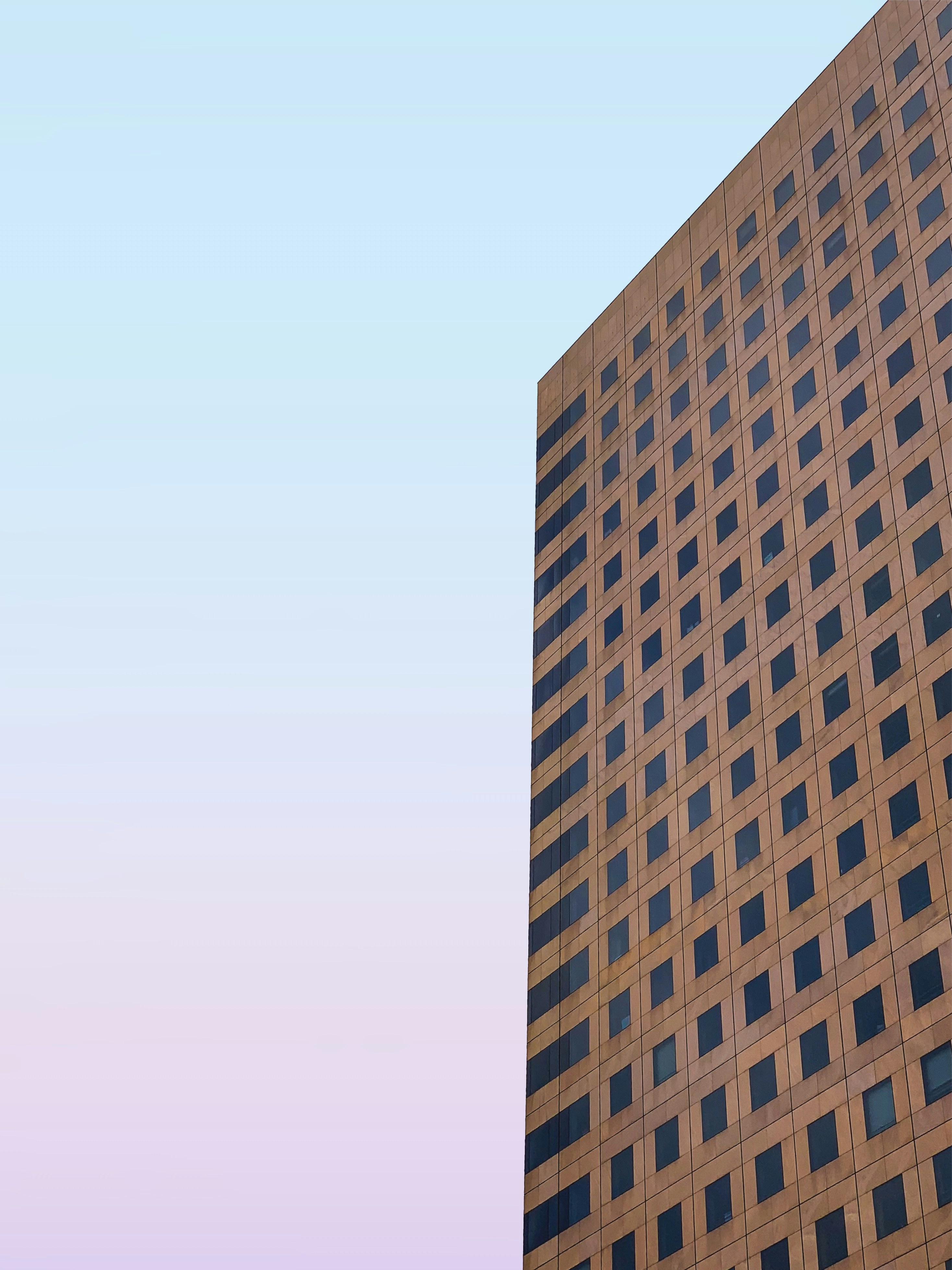 brown concrete building under blue sky
