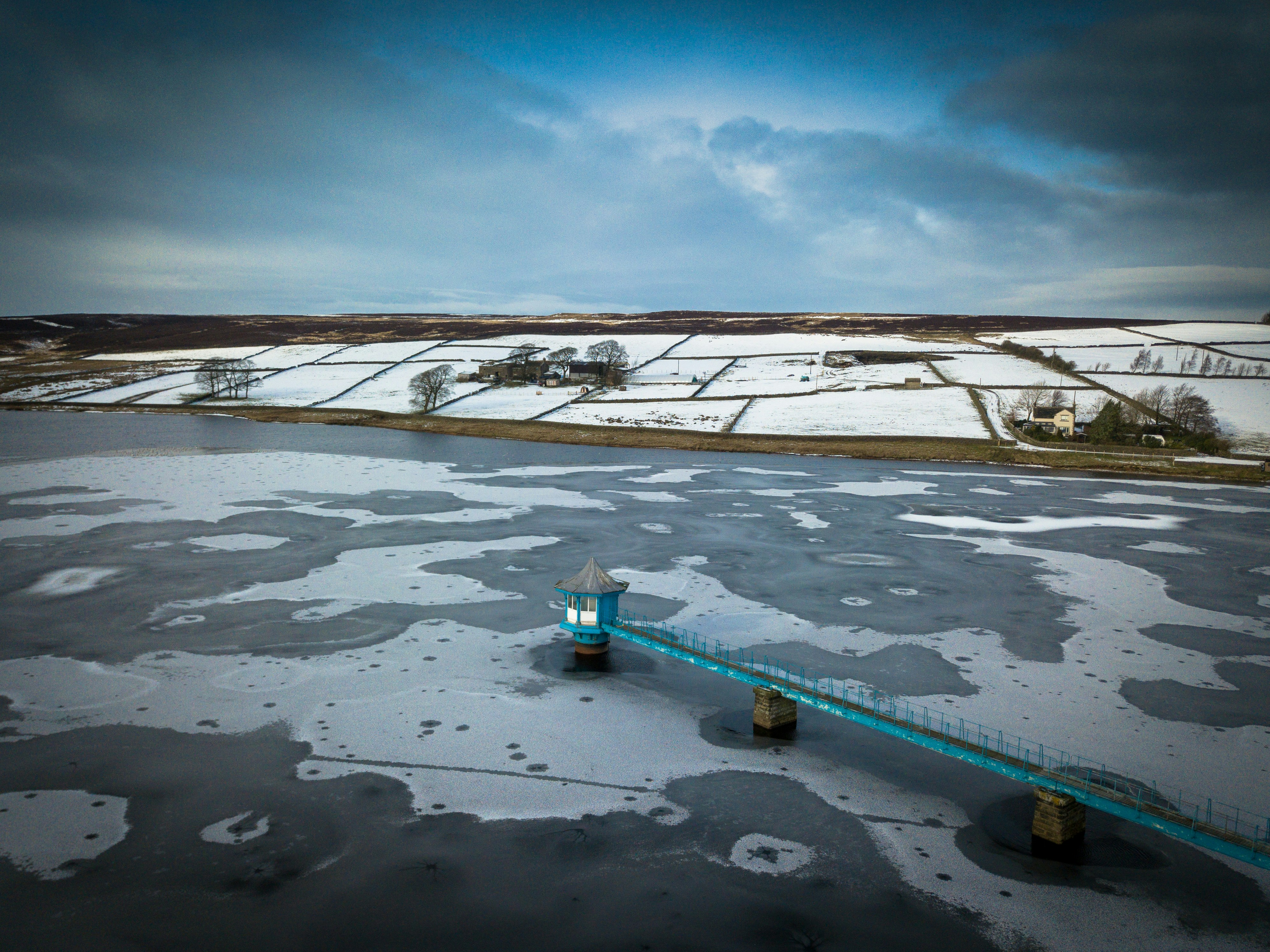 During this week’s snow in the UK, Leeshaw Reservoir in Oxenhope froze over. I thought it the perfect time to tackle the icy conditions and capture this magical scene with my drone.