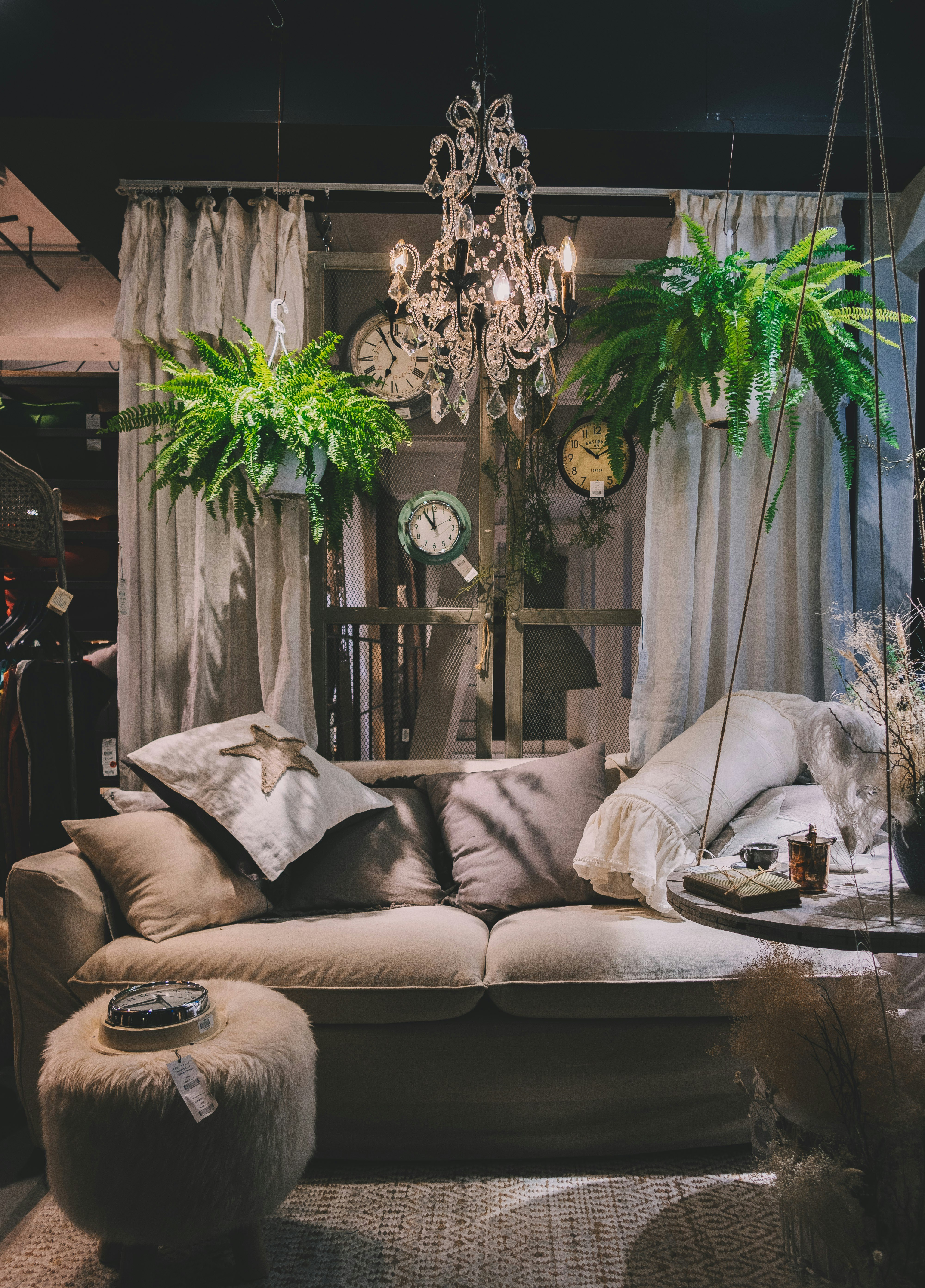 Chic living room still life with greenery and chandelier