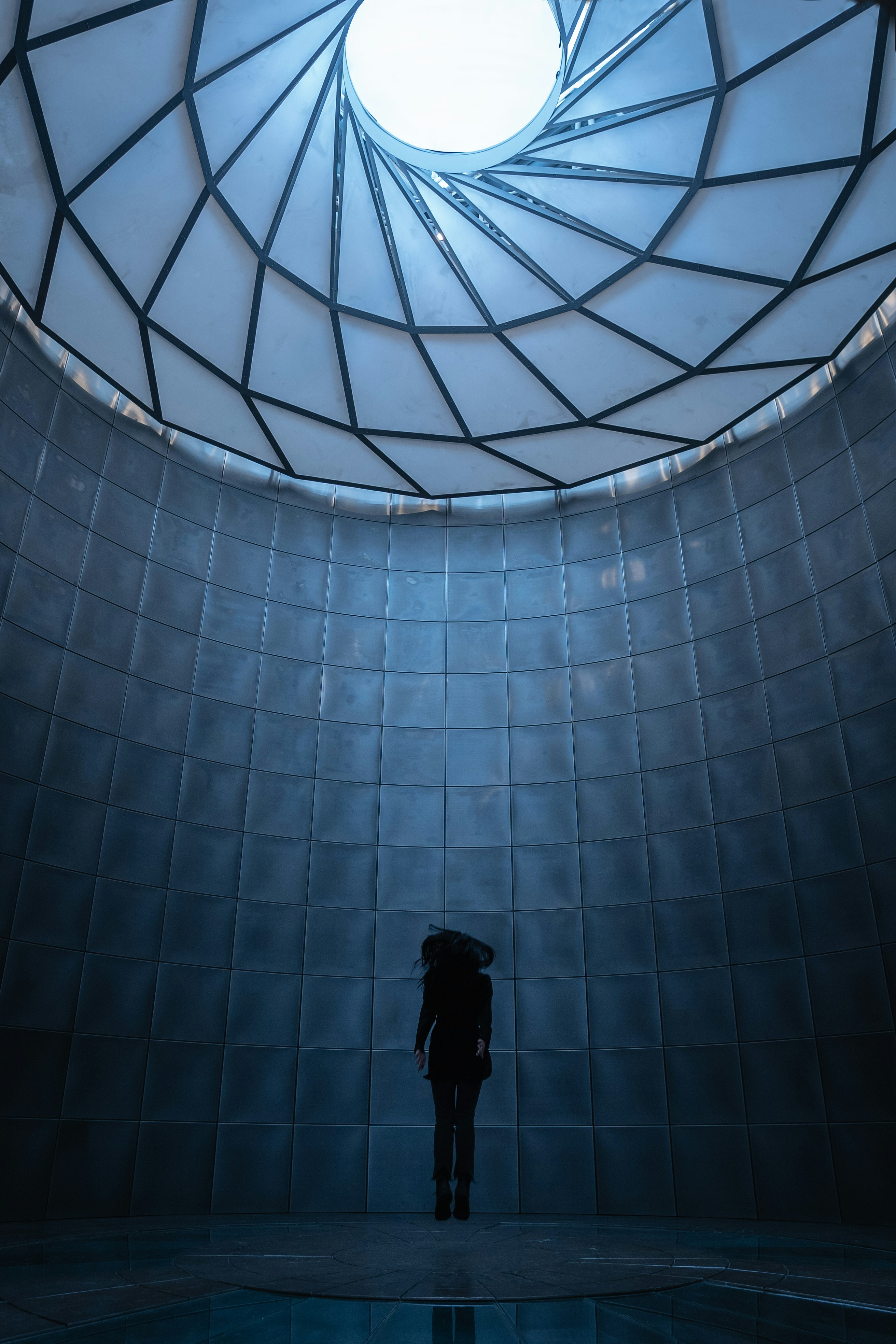 Woman standing inside building photo – Free Blue Image on Unsplash