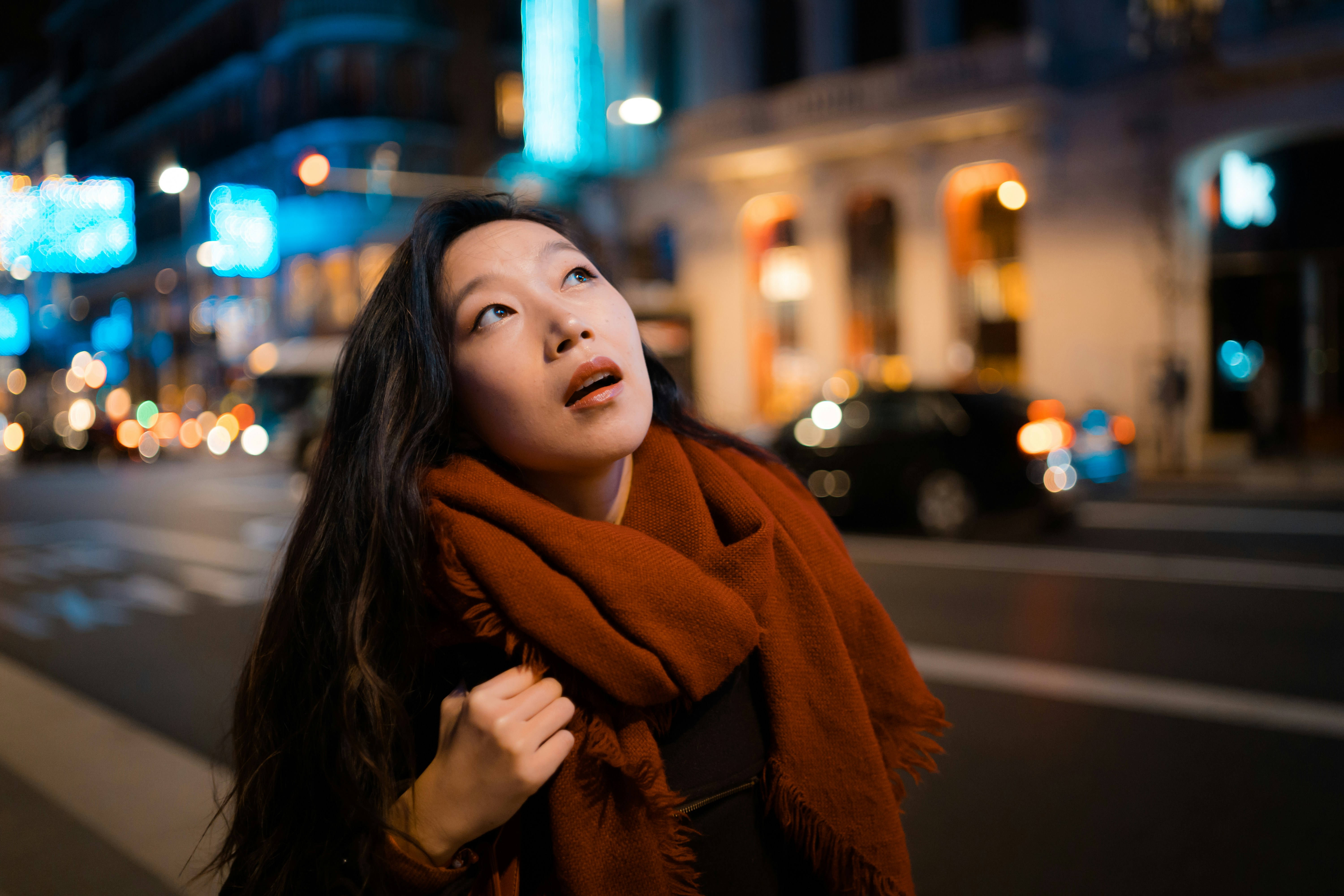 Urban Dreamer: A Moment of Wonder Amidst City Lights