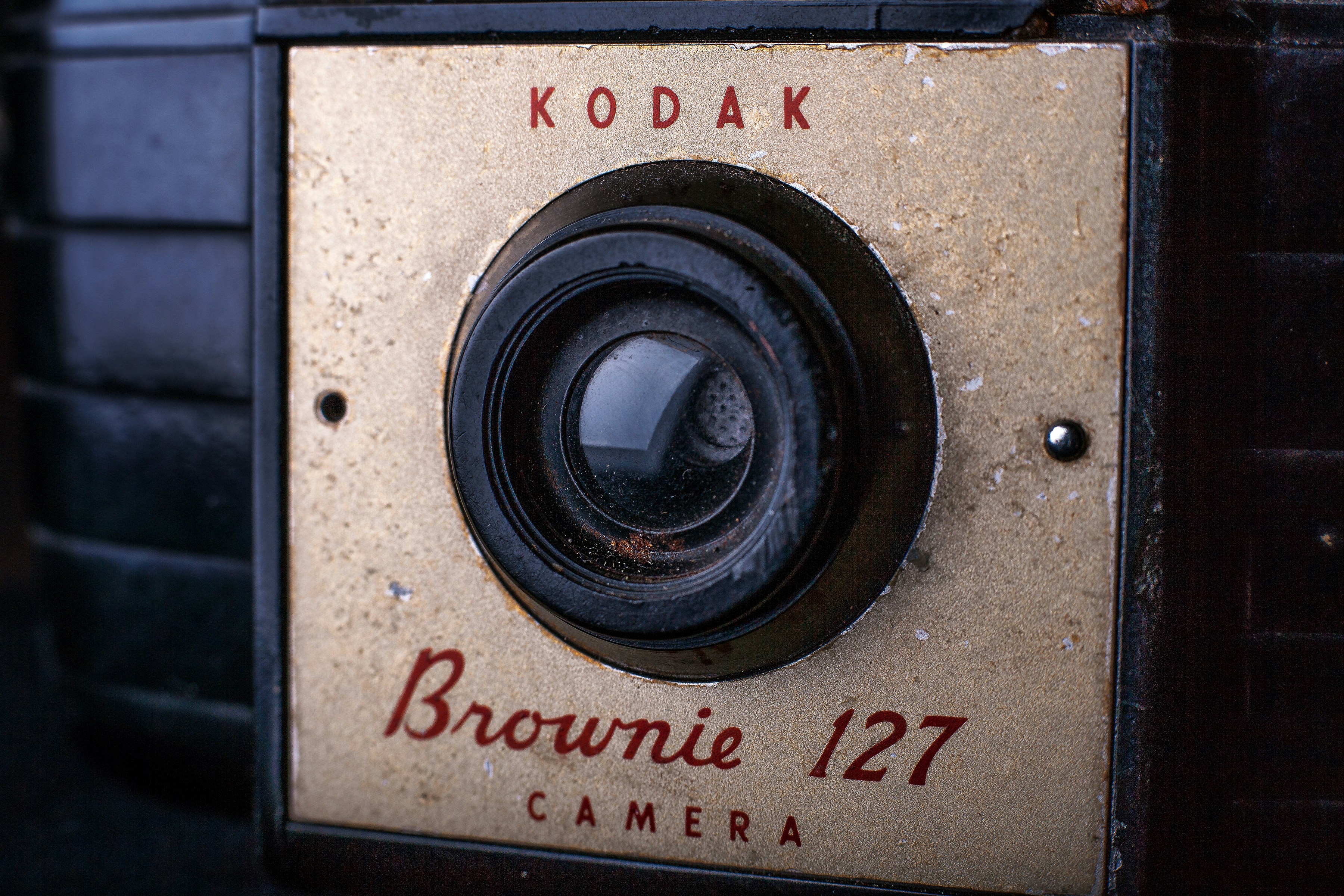 Close-up of a vintage Kodak Brownie 127 camera showcasing its iconic lens and design elements. A testament to classic photography craftsmanship.