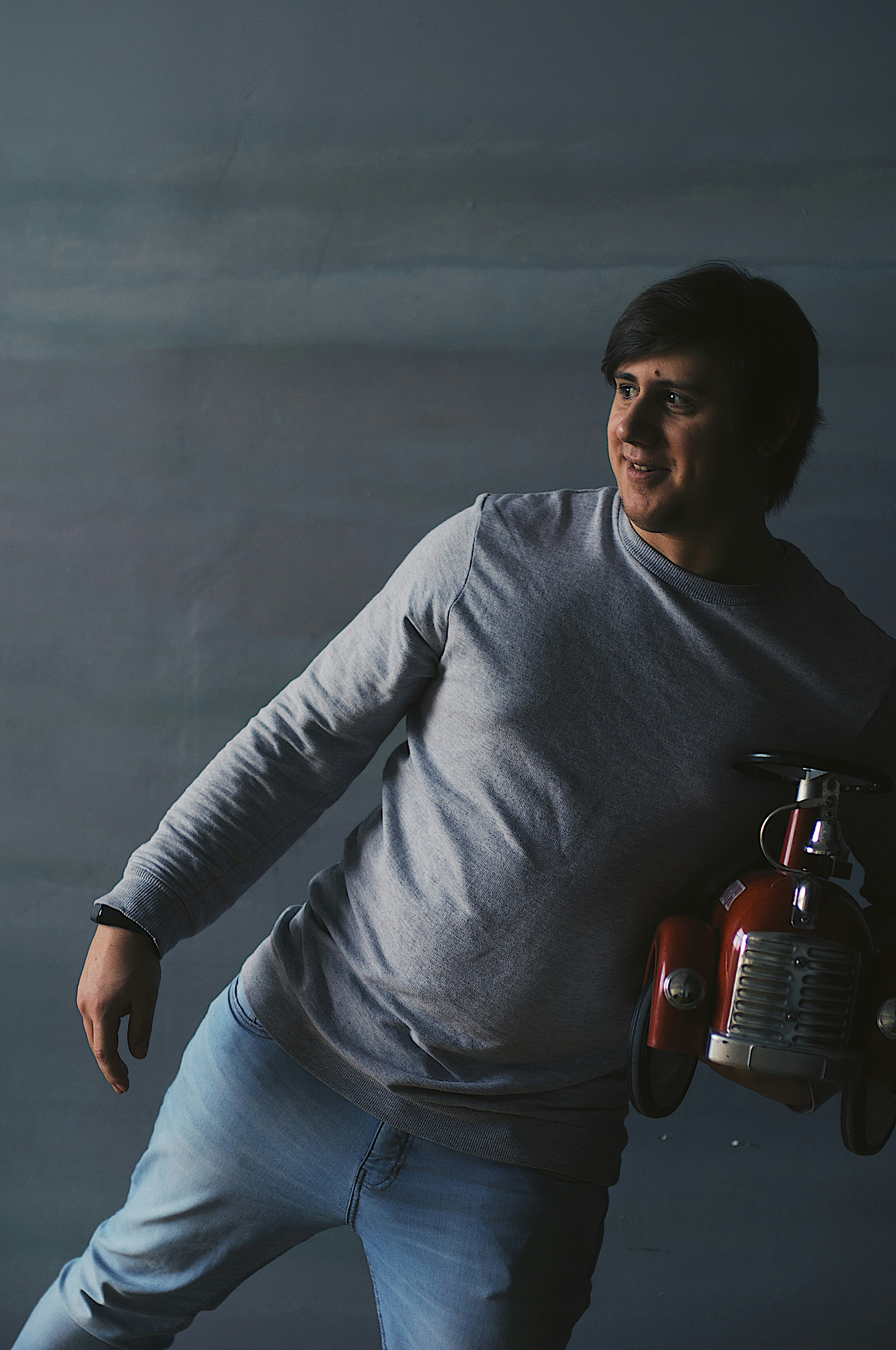 Tilted Light, Tiny Retro Scooter: A Casual Studio Portrait