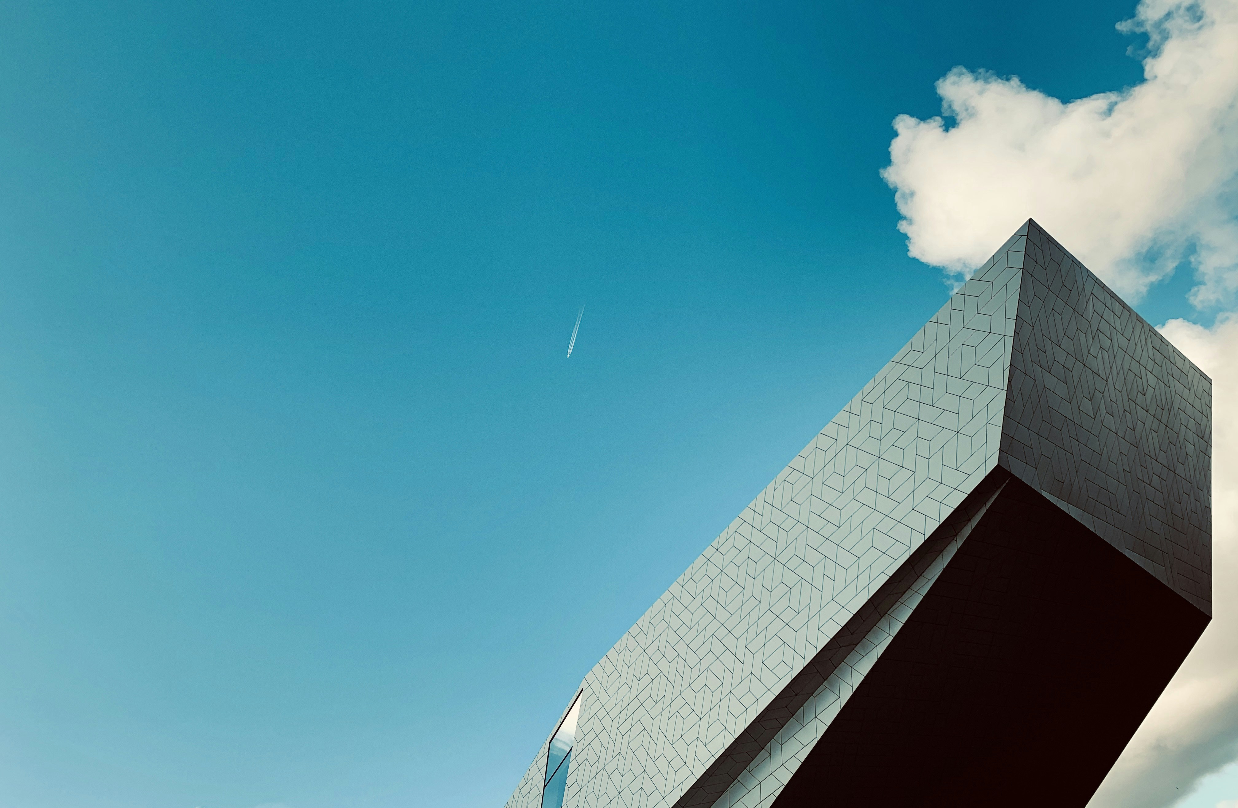 Crystalline Facade Reaching for the Cerulean Sky
