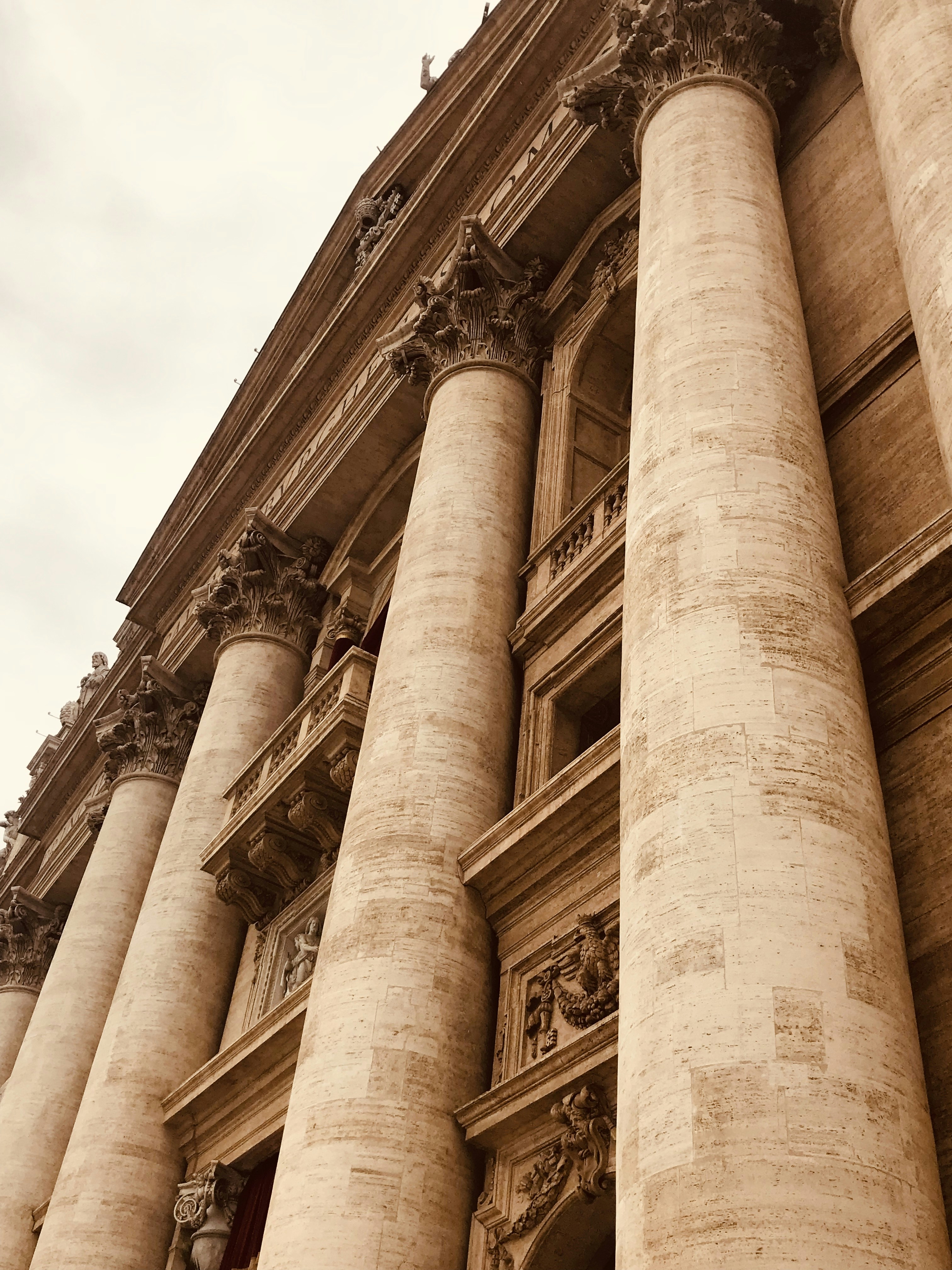 Imposing columns of a grand architectural structure, showcasing intricate details and historical significance.