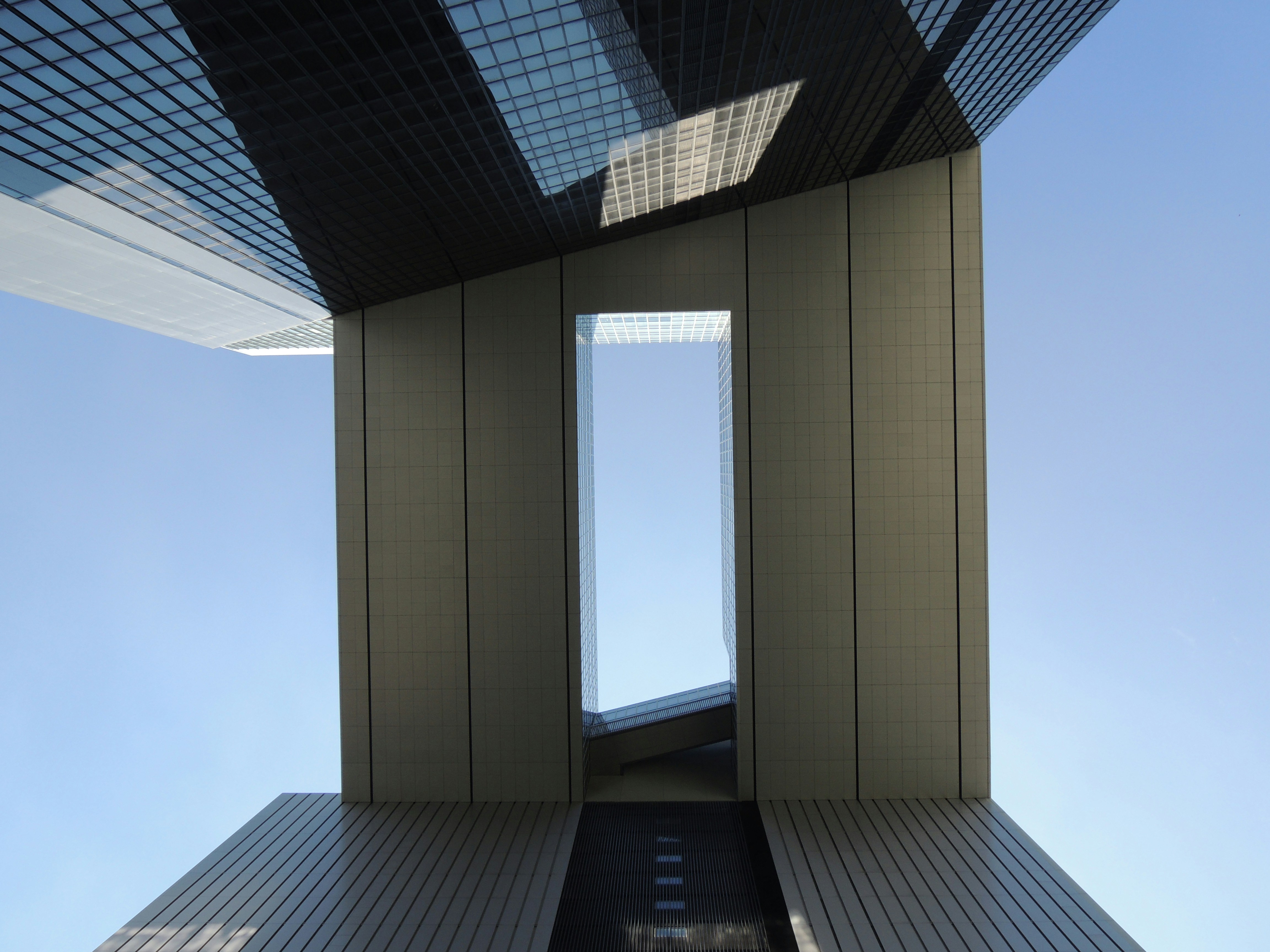 Low-angle photography of two buildings with bridge in between during ...