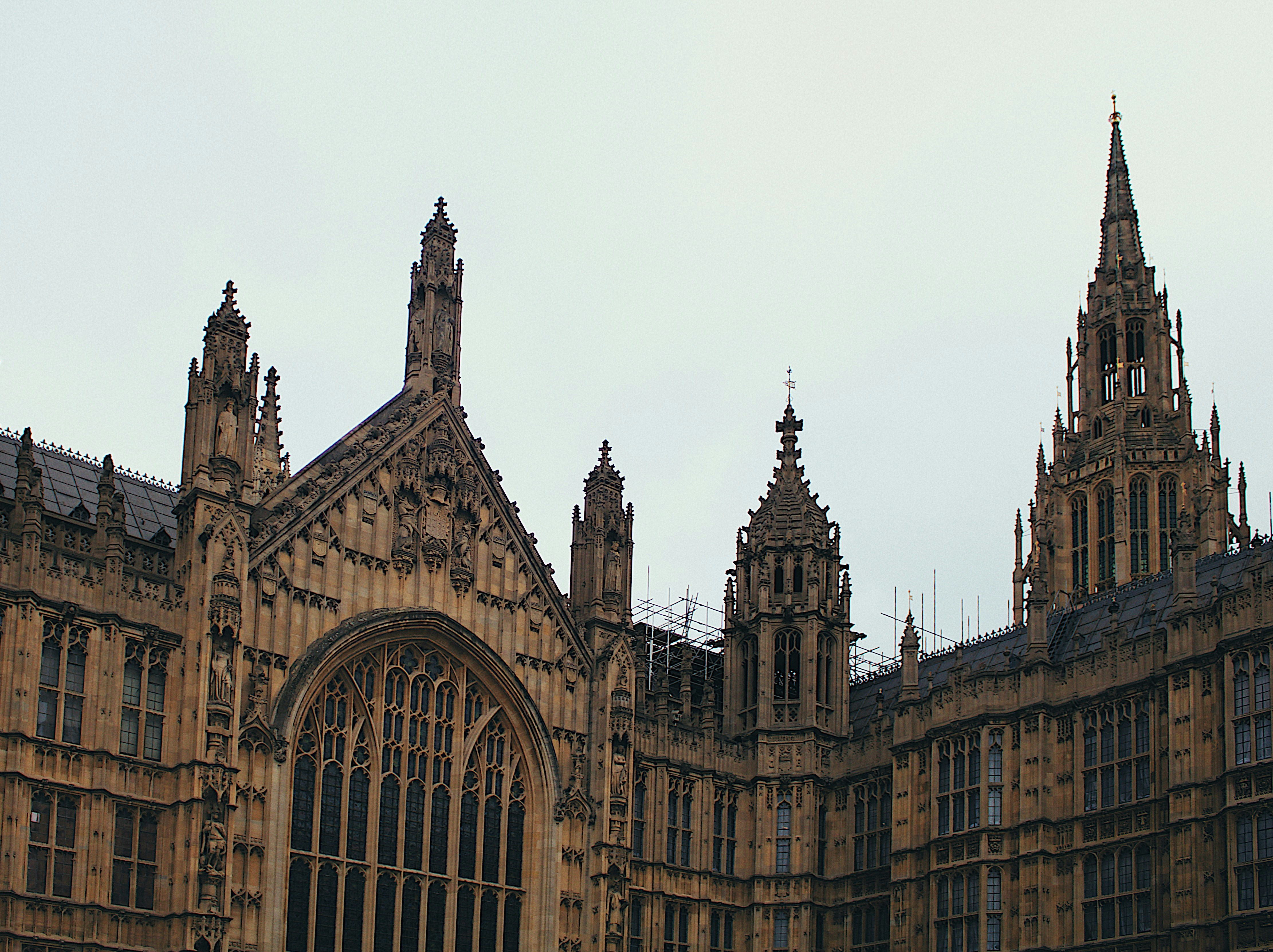 Intricate Gothic architecture of the Houses of Parliament, showcasing its iconic towers and detailed stonework.