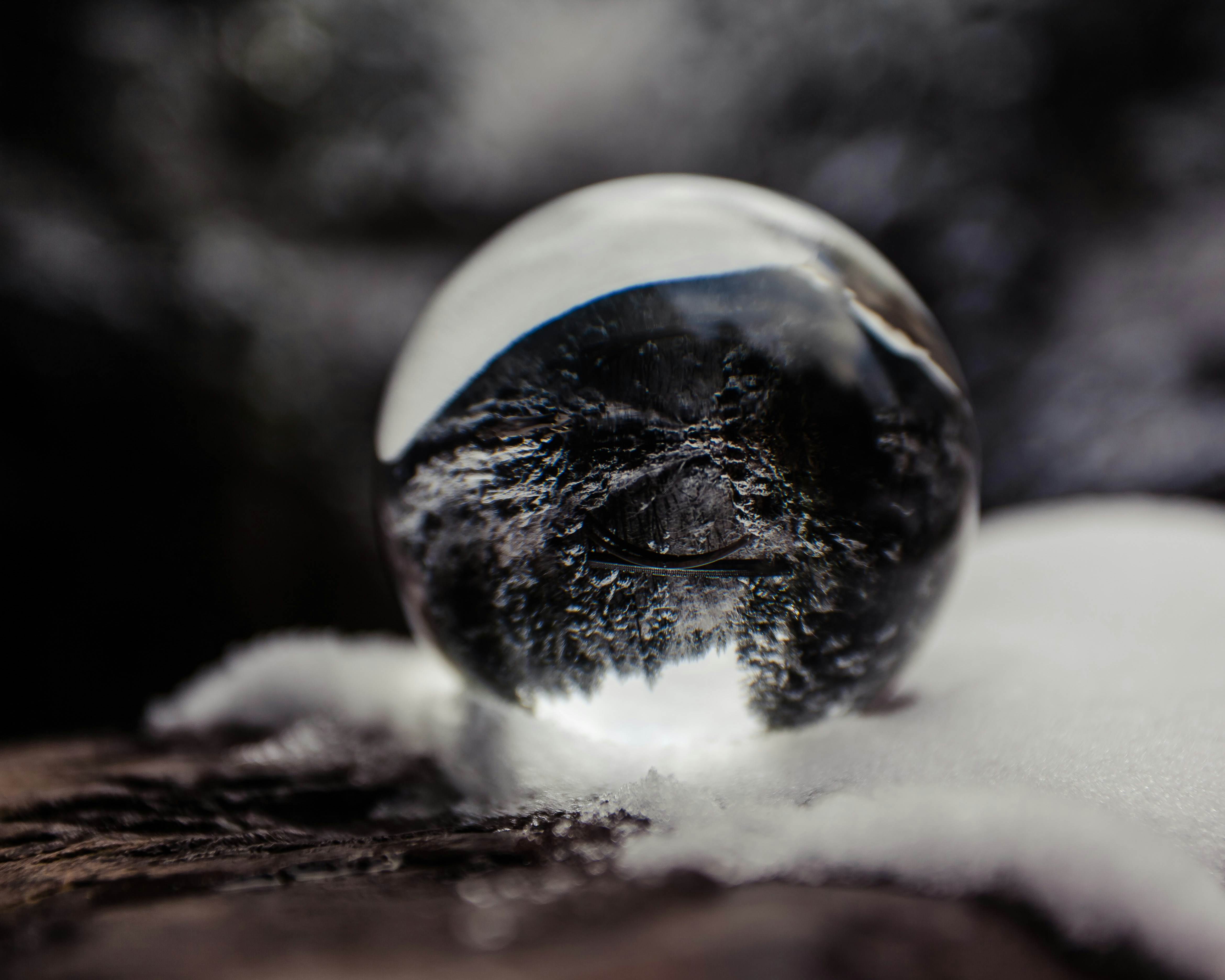 Ice Sphere Nodding Over a Snow-kissed Surface