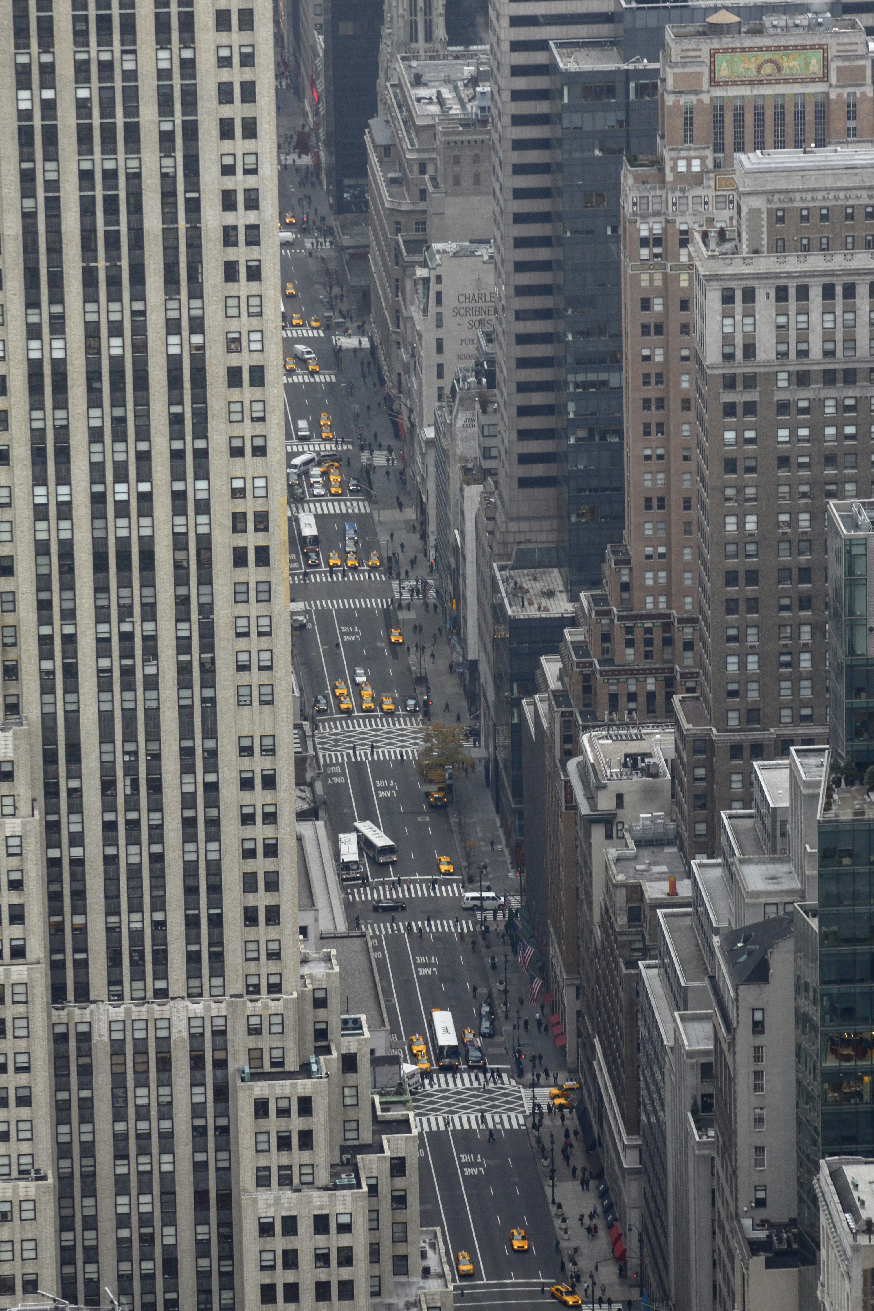 Aerial photography of vehicle passing on road between concrete high ...