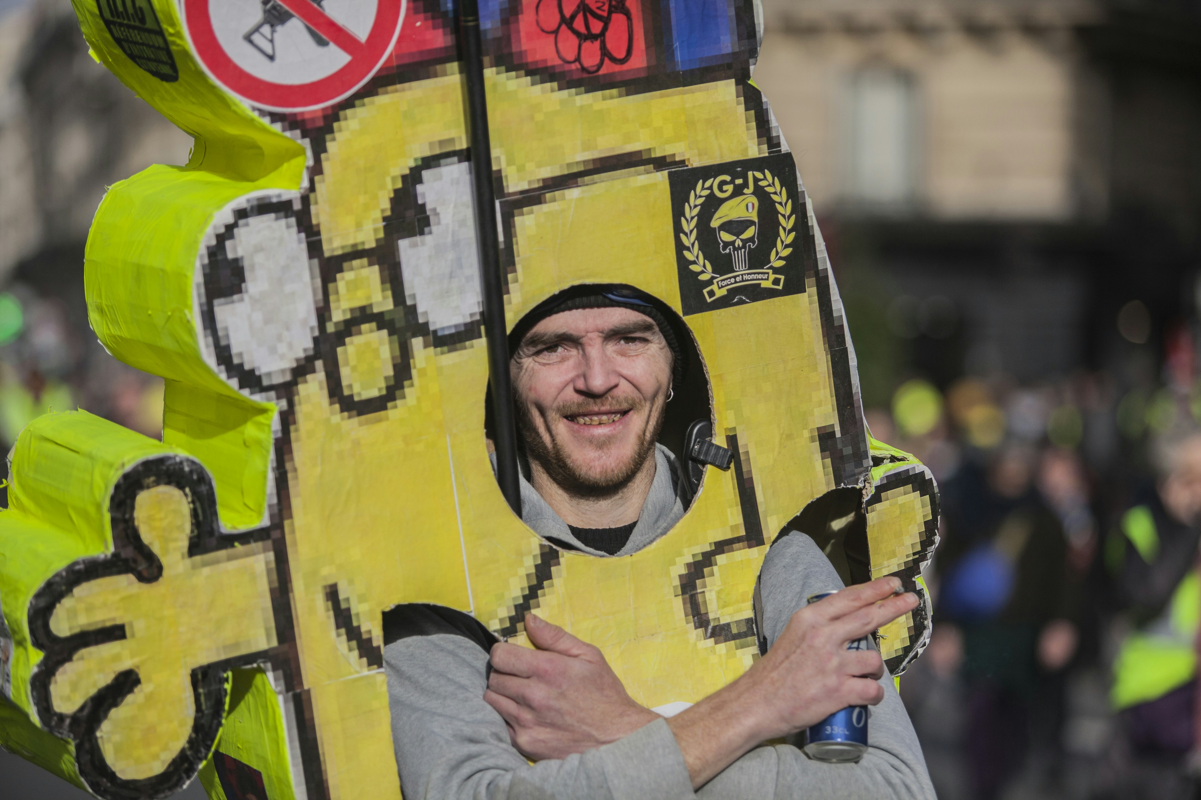 Peeking Through the Toon: A Neon-Yellow Cartoon Cutout at a Street Festival