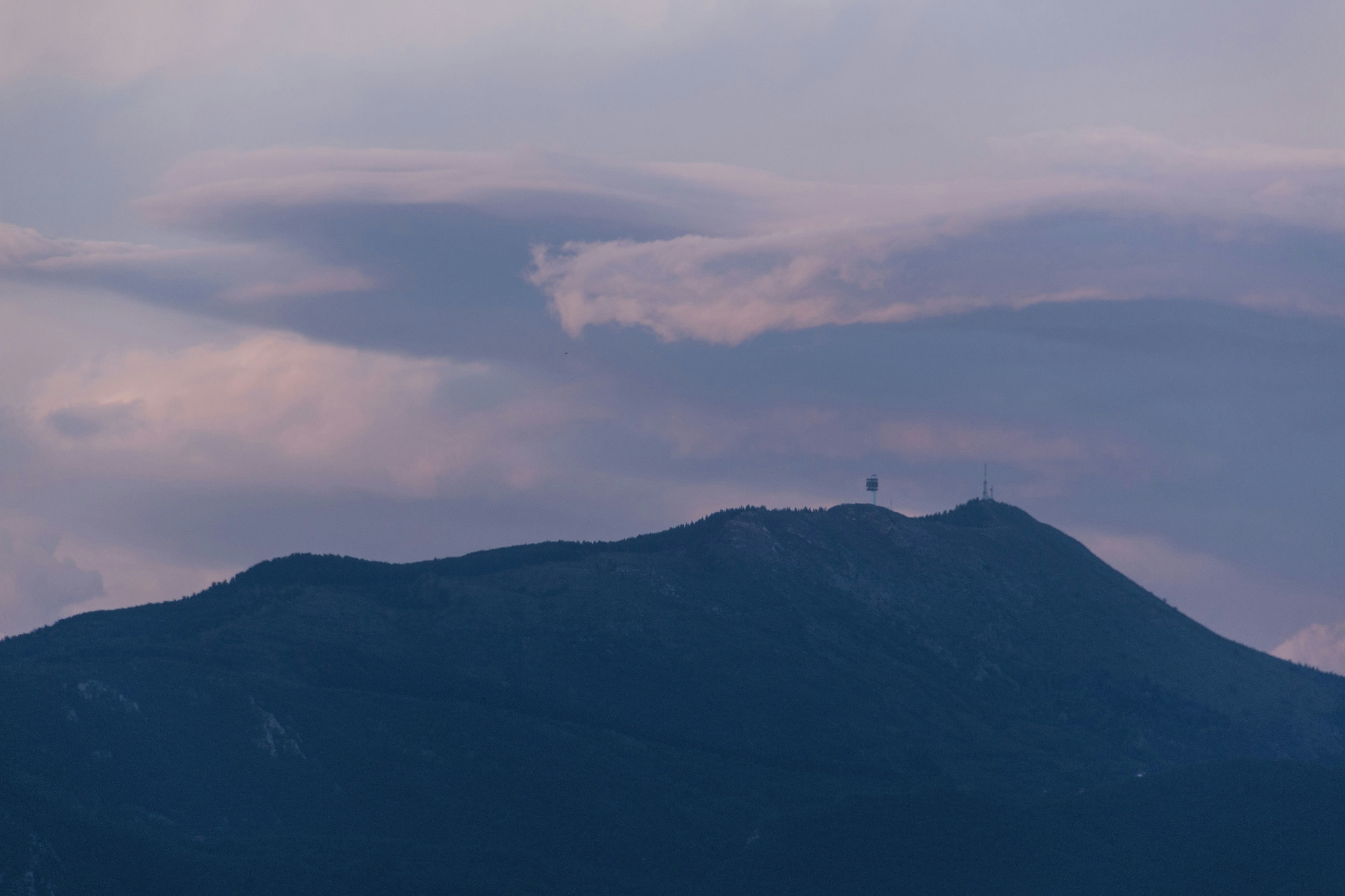 Dusk Crest: a solitary antenna crowns a quiet mountain ridge